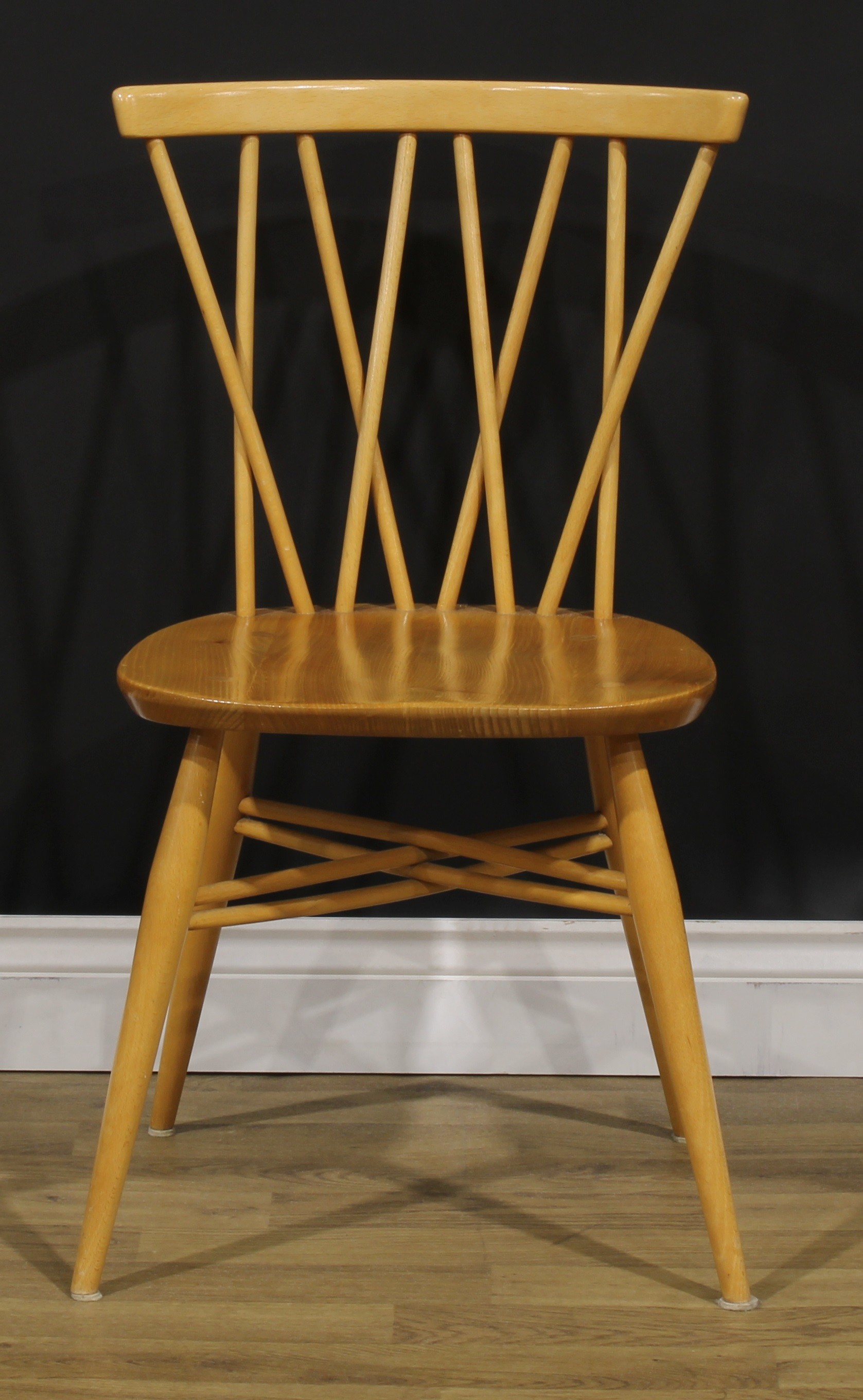A set of four Ercol candlestick dining chairs, 79cm high, 46cm wide ...