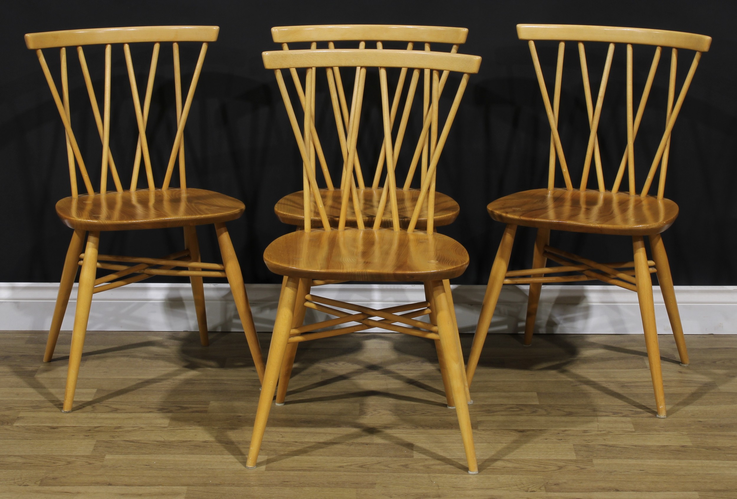 A set of four Ercol candlestick dining chairs, 79cm high, 46cm wide ...