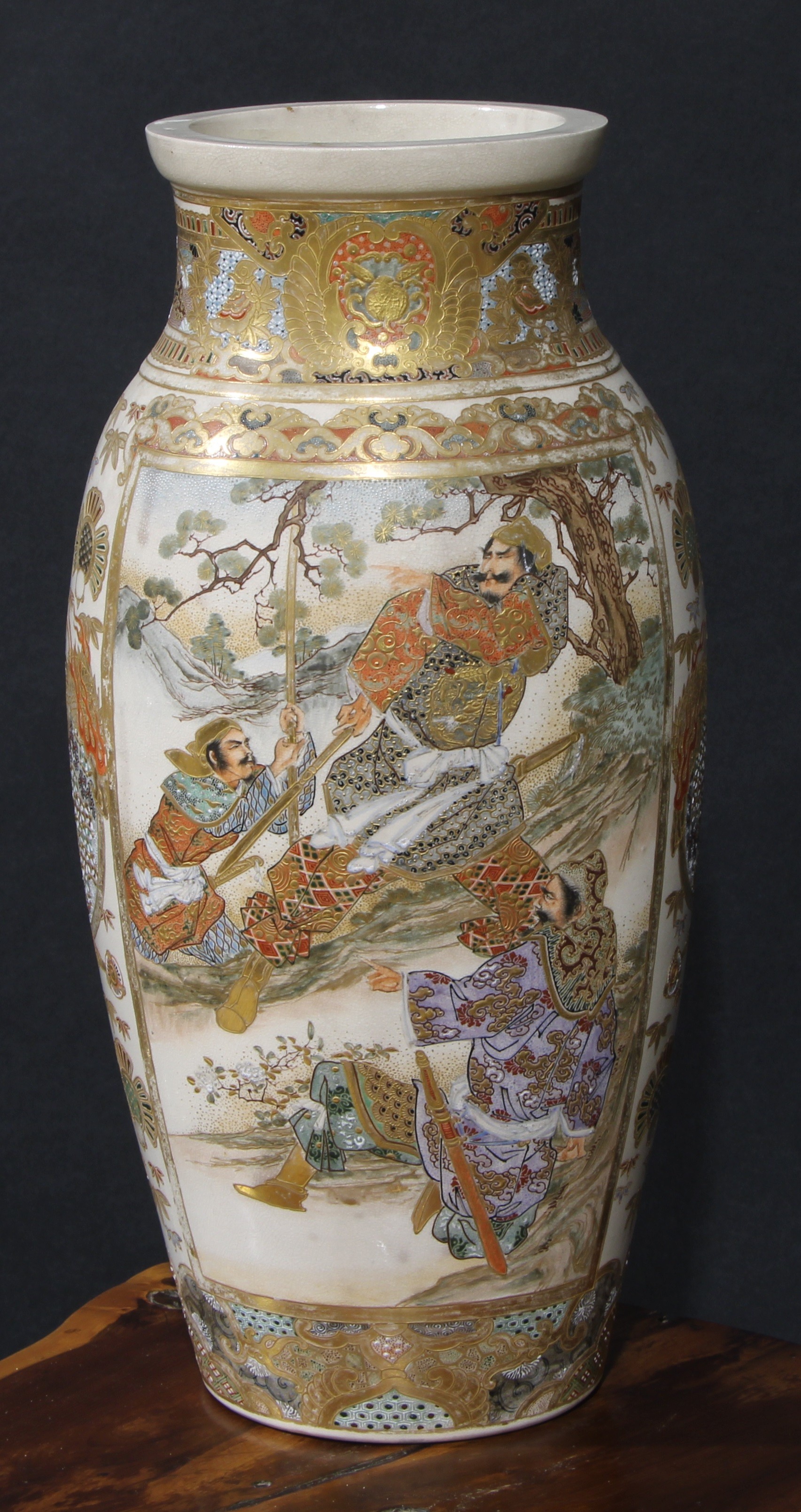 A Japanese Satsuma ovoid vase, painted in the typical palette with ...