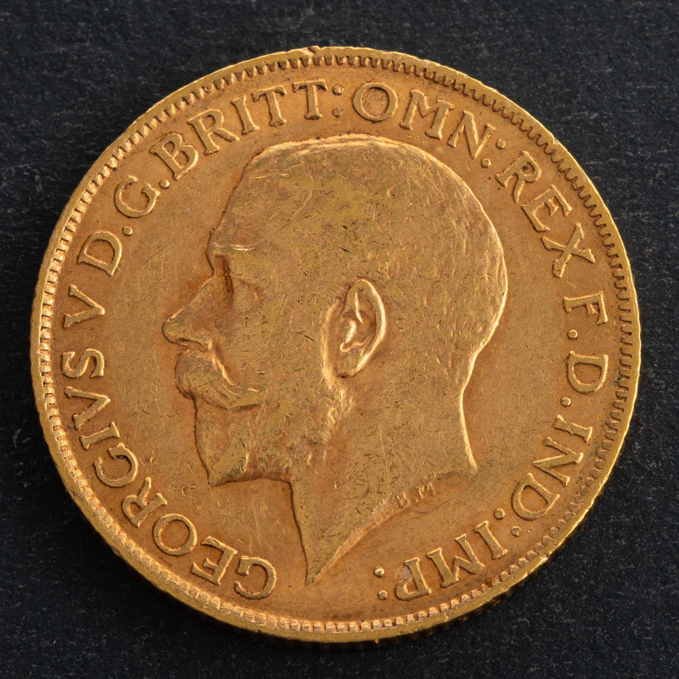 A George V sovereign coin, dated 1911, diameter ca. 21.9mms, total ...