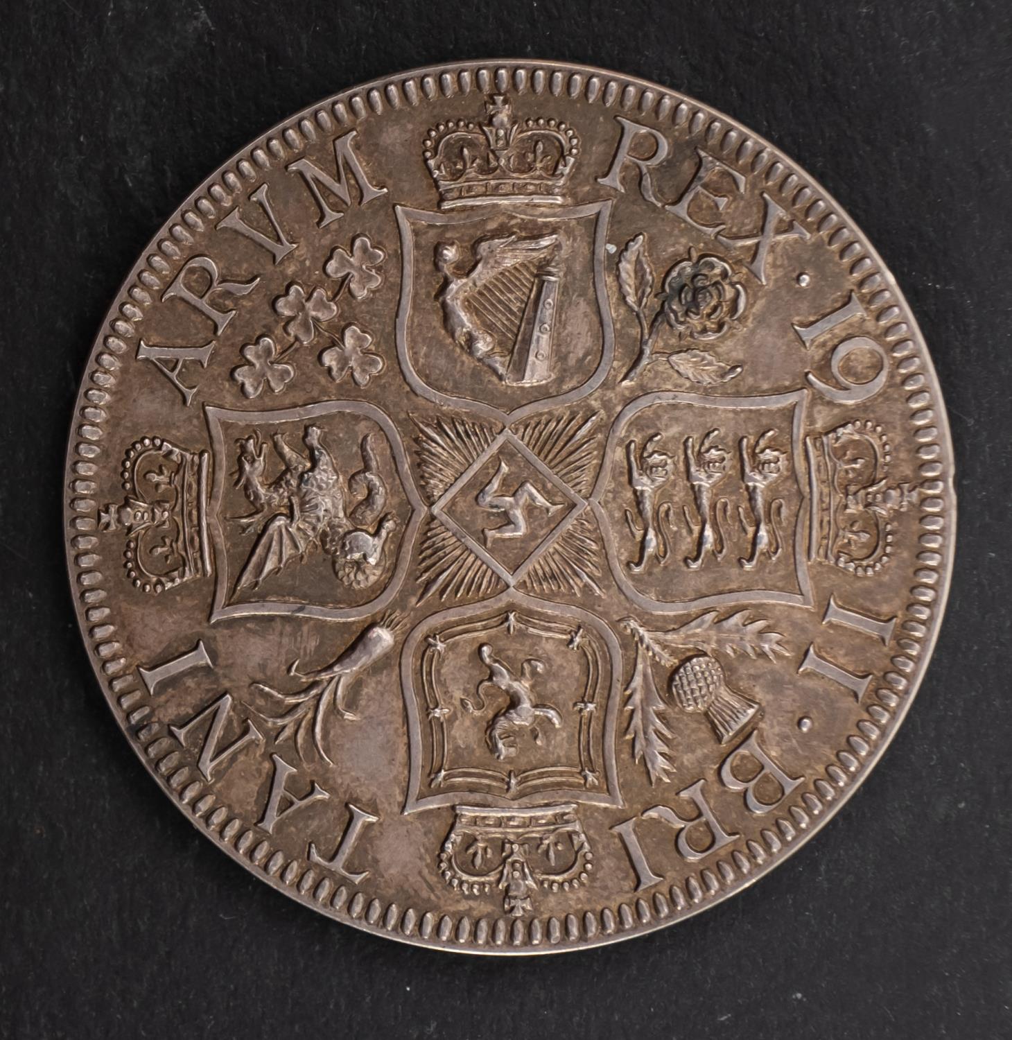 A rare 1911 plain edge double pattern Florin by Reginal Huth.