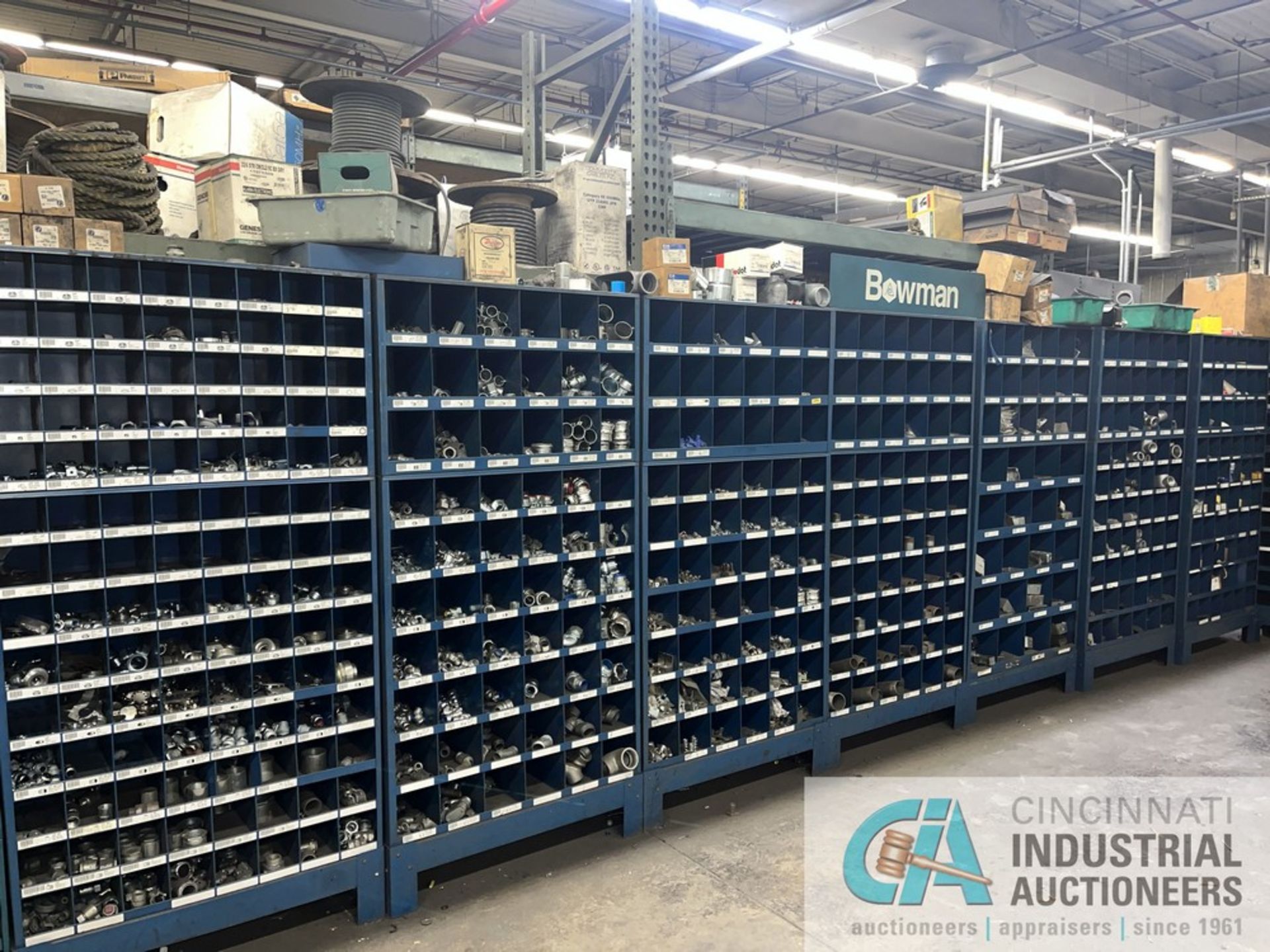 (7) SECTIONS OF STACKED STORAGE BINS WITH CONTENTS; ELECTRICAL PLUGS ...