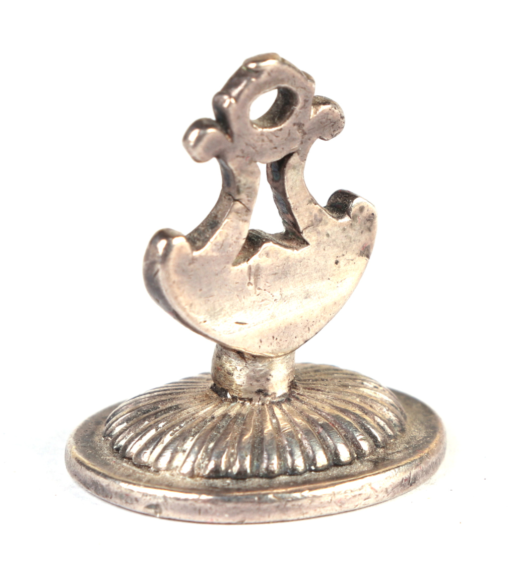 An 18th century continental white metal fob seal, the matrix engraved ...