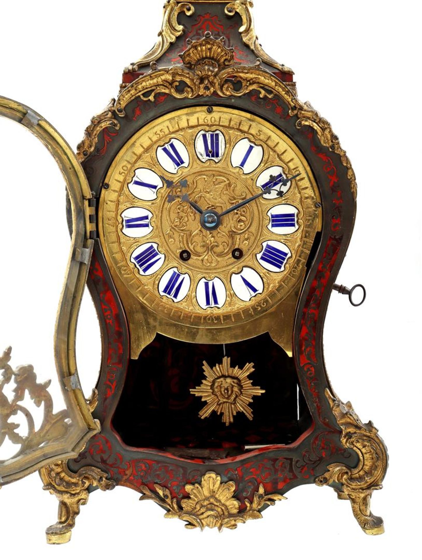 Neuchatel console clock with a trumpet-blowing angel on top, decorated with wood with tortoise de