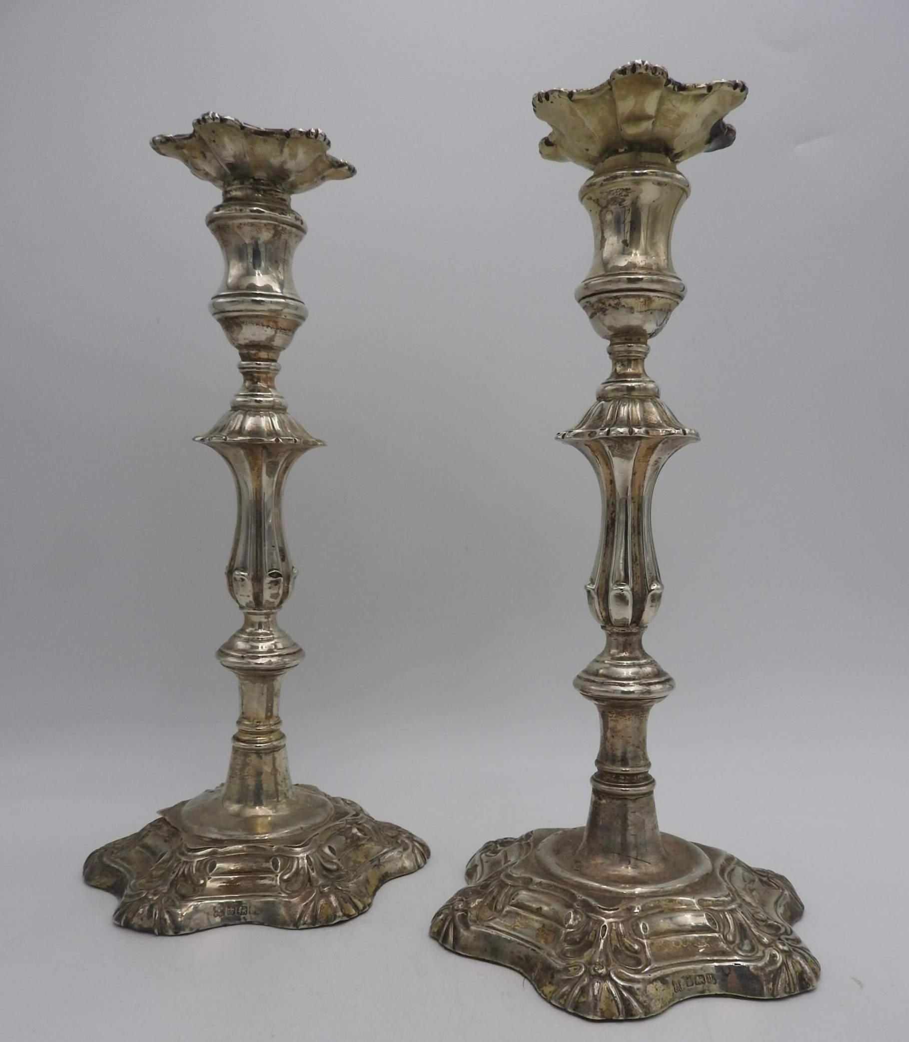 A PAIR OF SILVER , with knopped fluted pillars on stepped scroll work ...