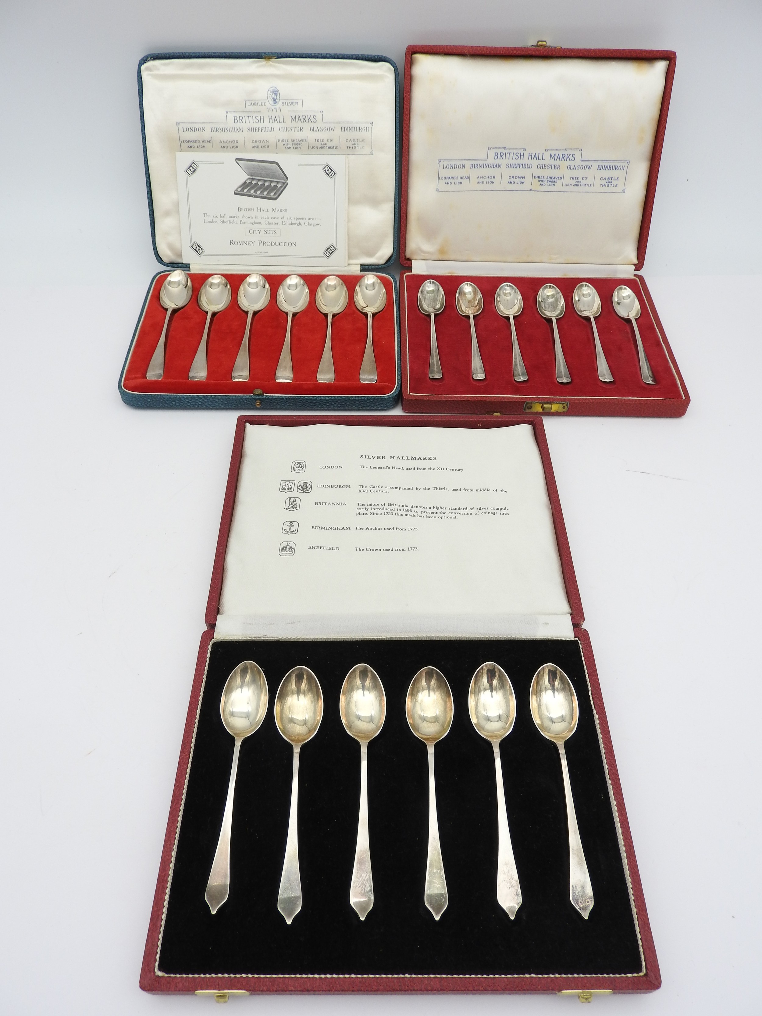 THREE BOXED SETS OF 'BRITISH HALLMARKS' SILVER TEASPOONS, part of a ...