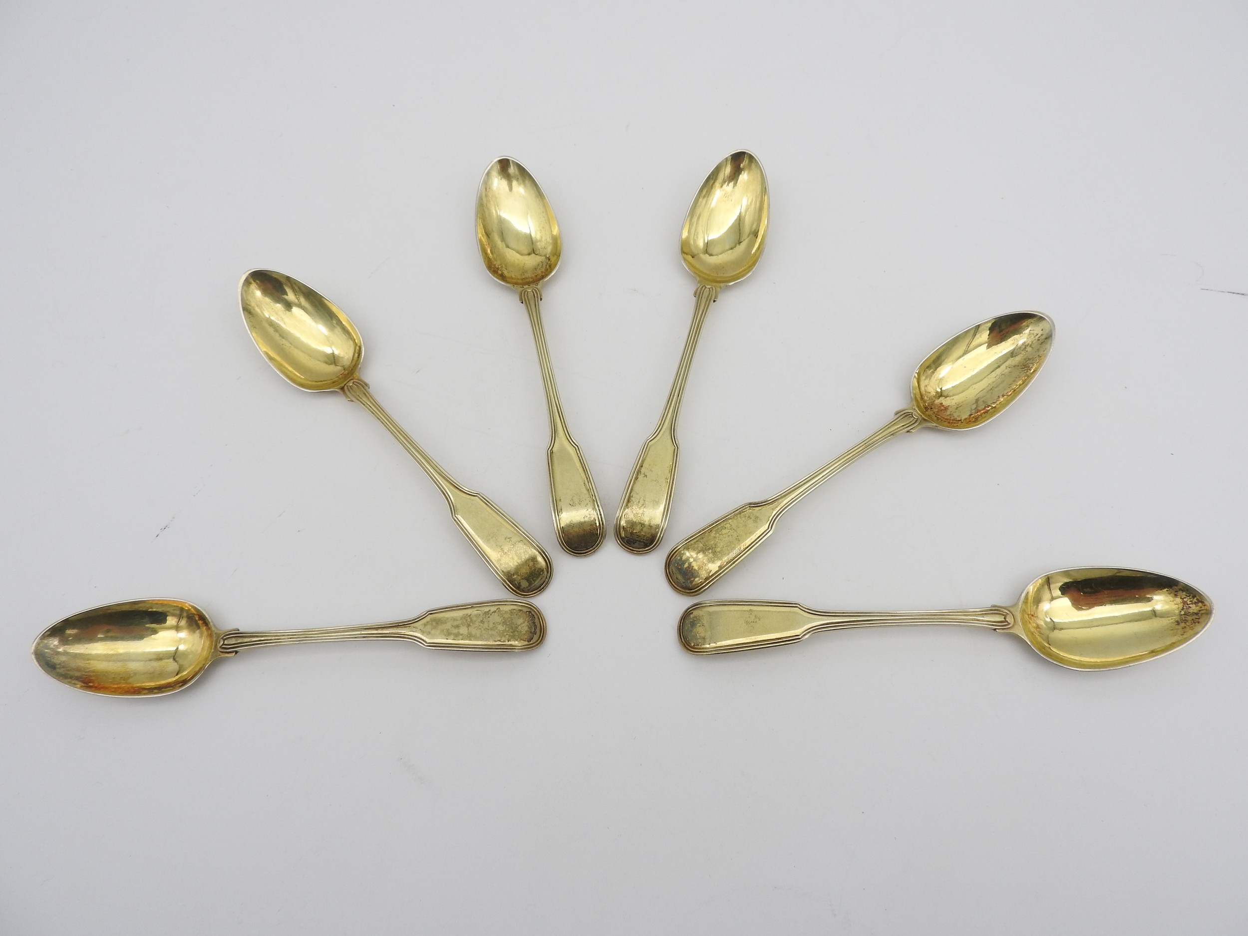 A SET OF SIX WILLIAM IV SILVER-GILT TEASPOONS, the fiddle pattern ...