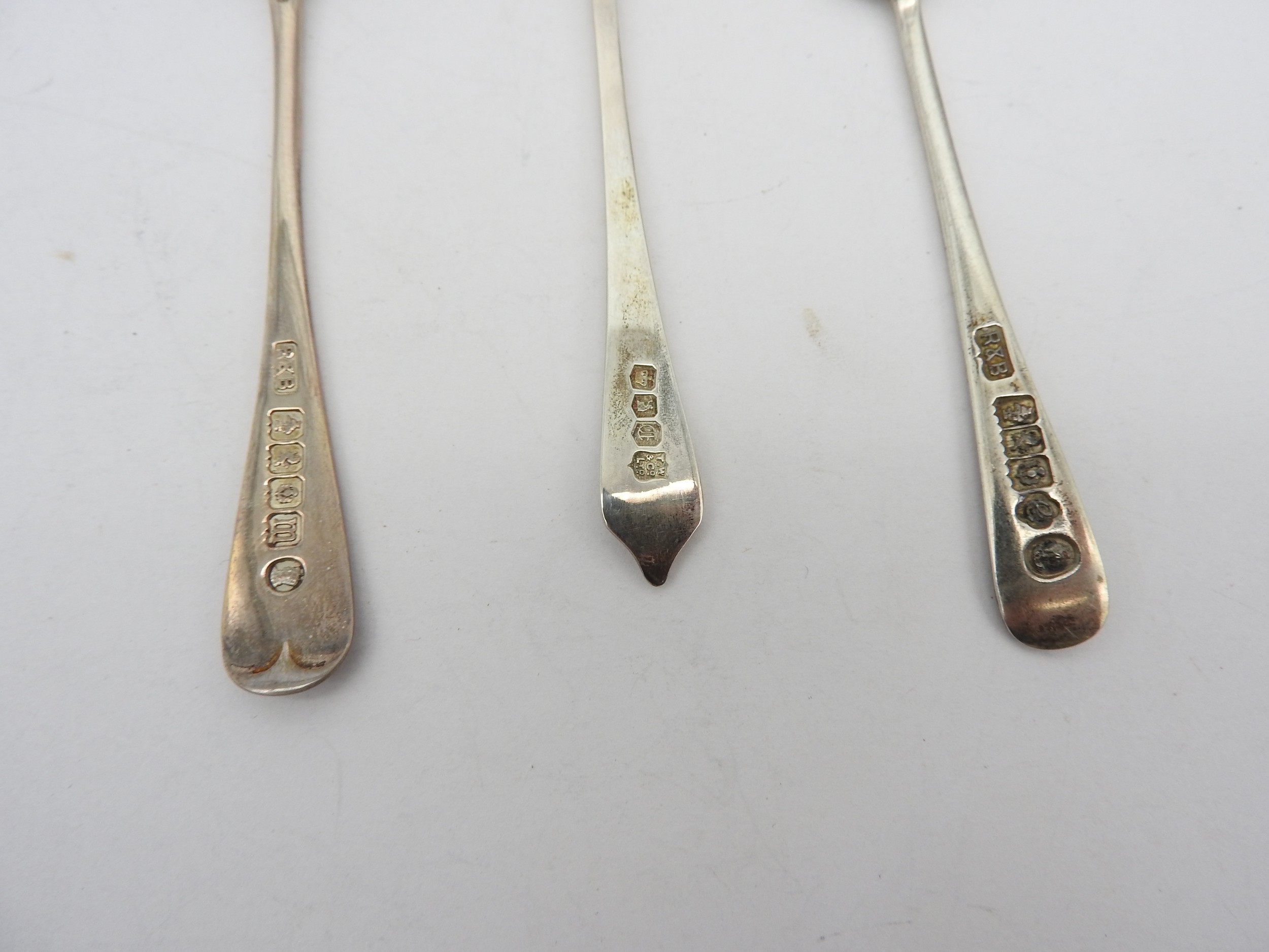 THREE BOXED SETS OF 'BRITISH HALLMARKS' SILVER TEASPOONS, part of a ...