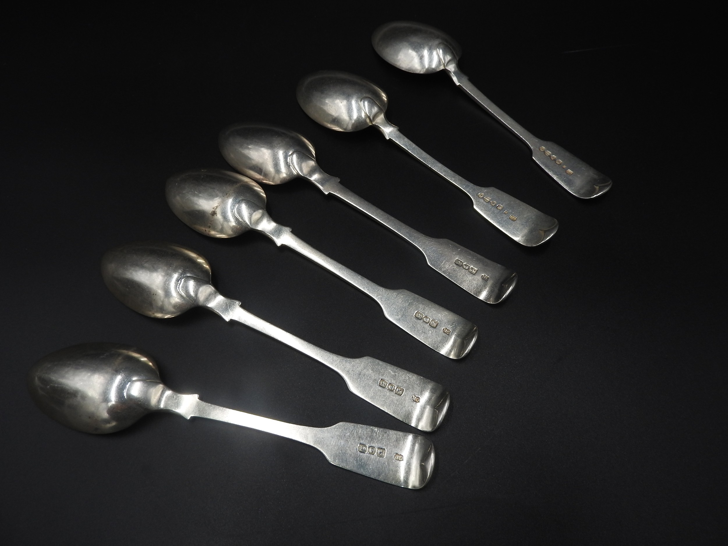 SIX 19TH CENTURY DESSERT SPOONS, all fiddle pattern, the lot comprised ...