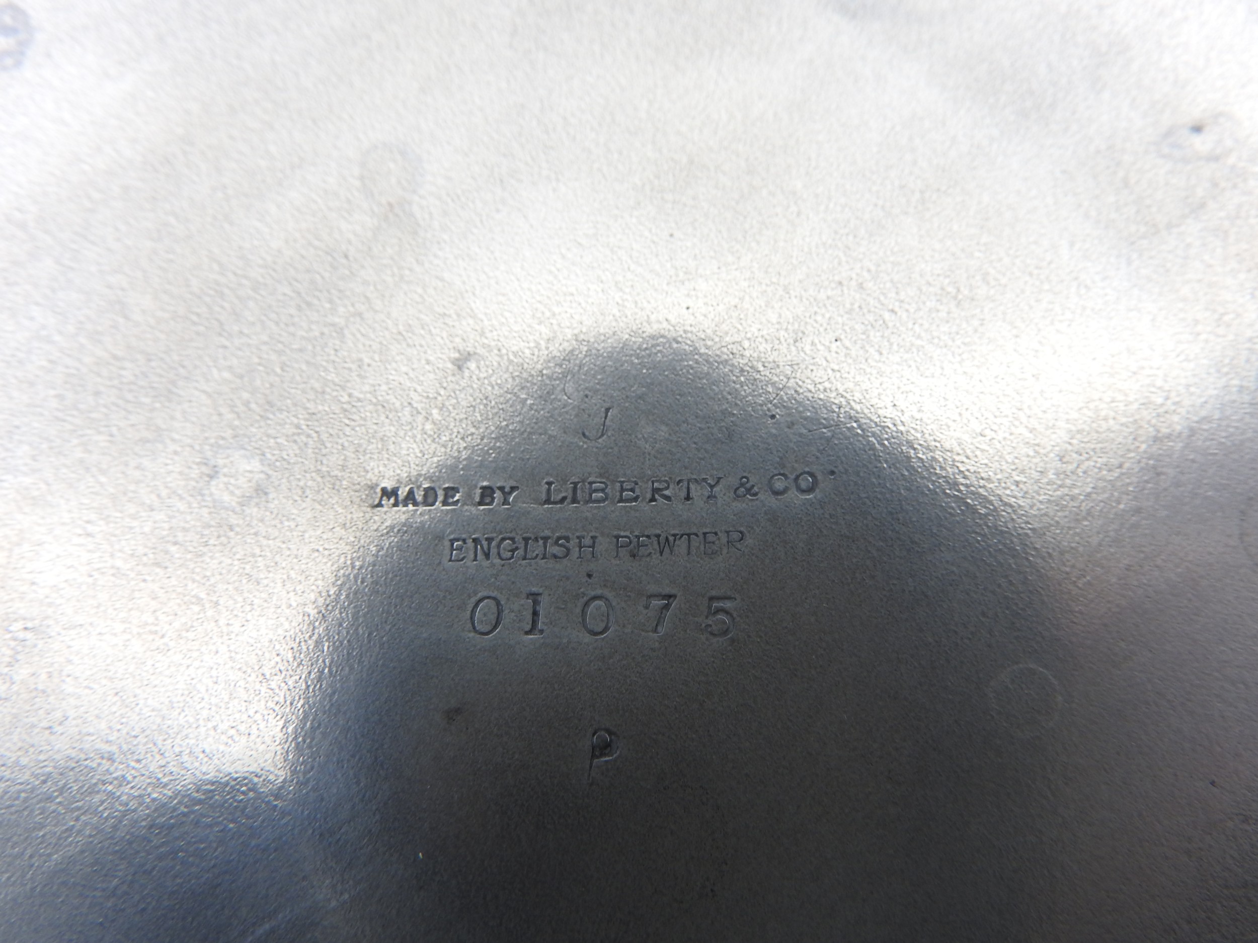 A LIBERTY FIVE PEWTER TEA SET with hammered finish marked 'Made by ...