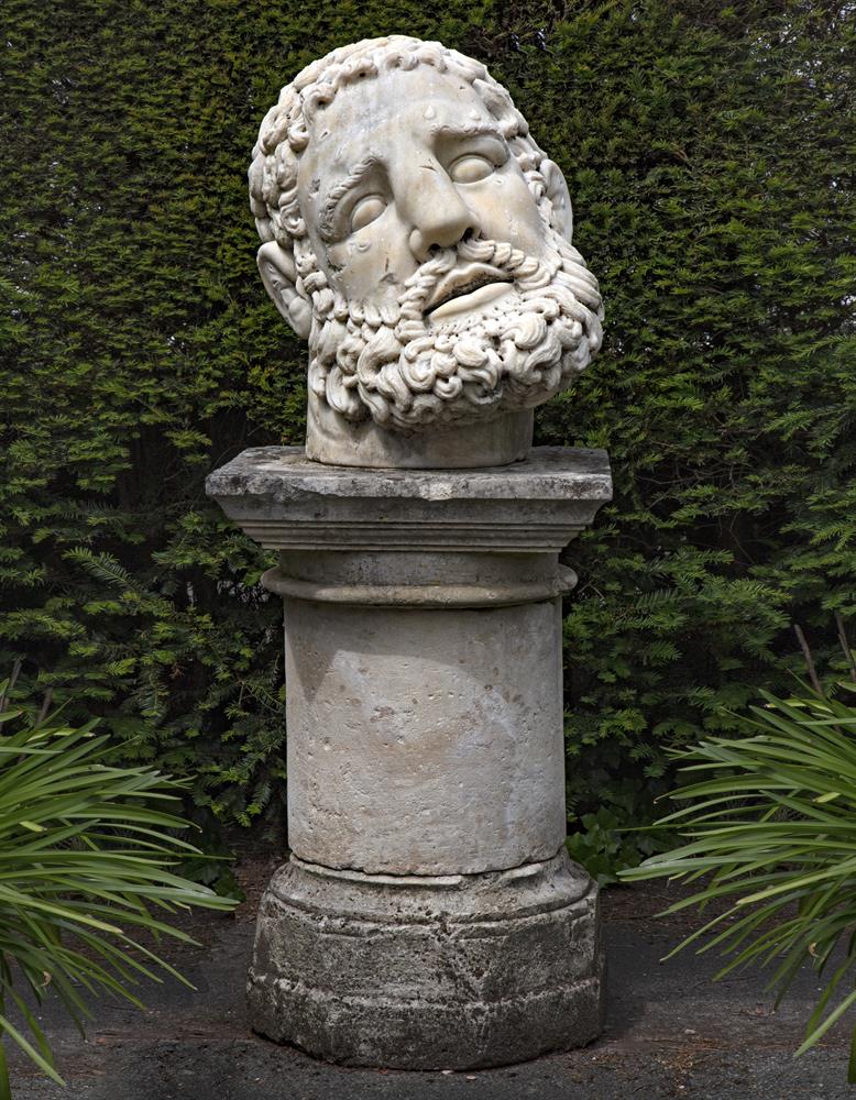 Ω A COLOSSAL SCULPTED WHITE MARBLE MODEL OF THE HEAD OF HERCULES ...