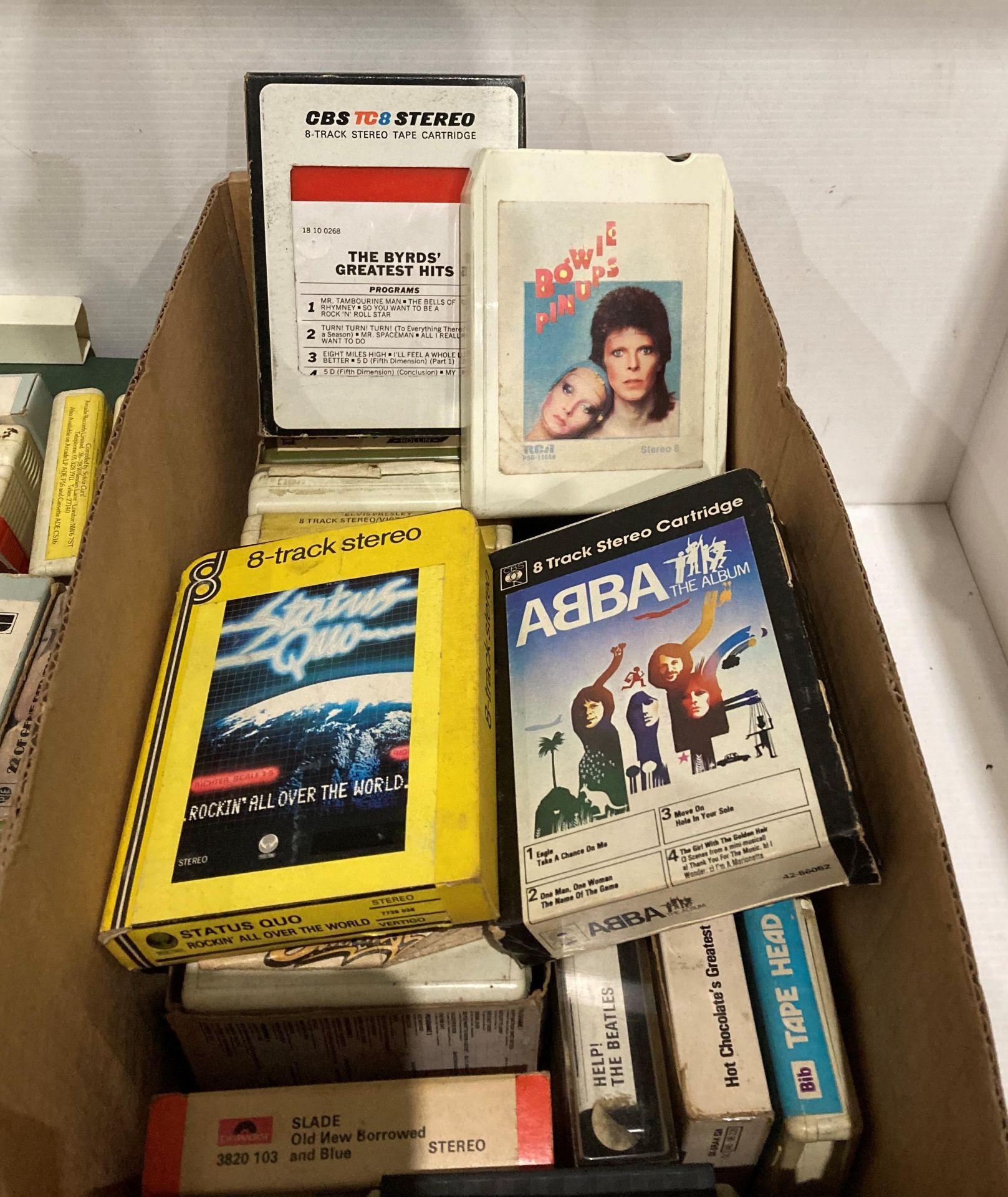 Approximately one hundred assorted 8-track cartridges including Beatles ...