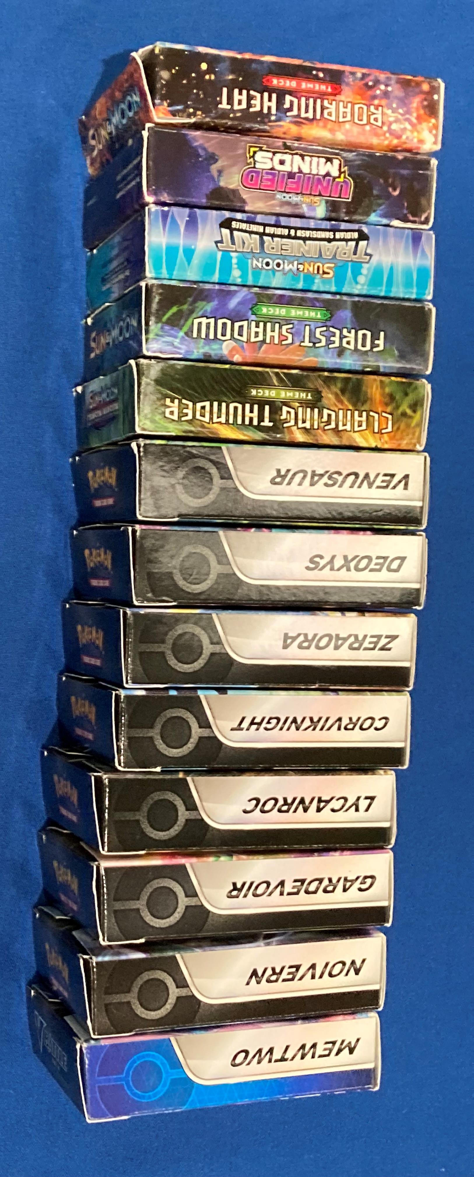 Thirteen packs of Pokémon cards including Sun & Moon decks, V Battle ...