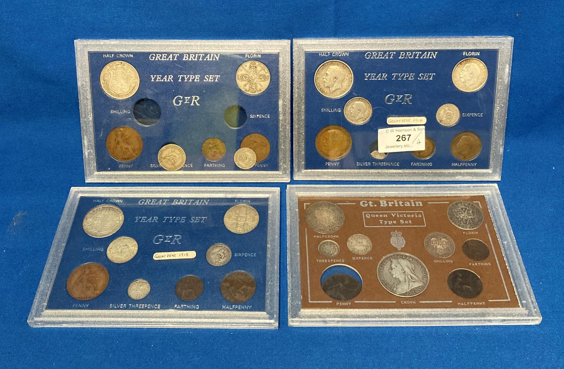 Four Great Britain coin sets in cases including years 1990, 1914, 1915 ...