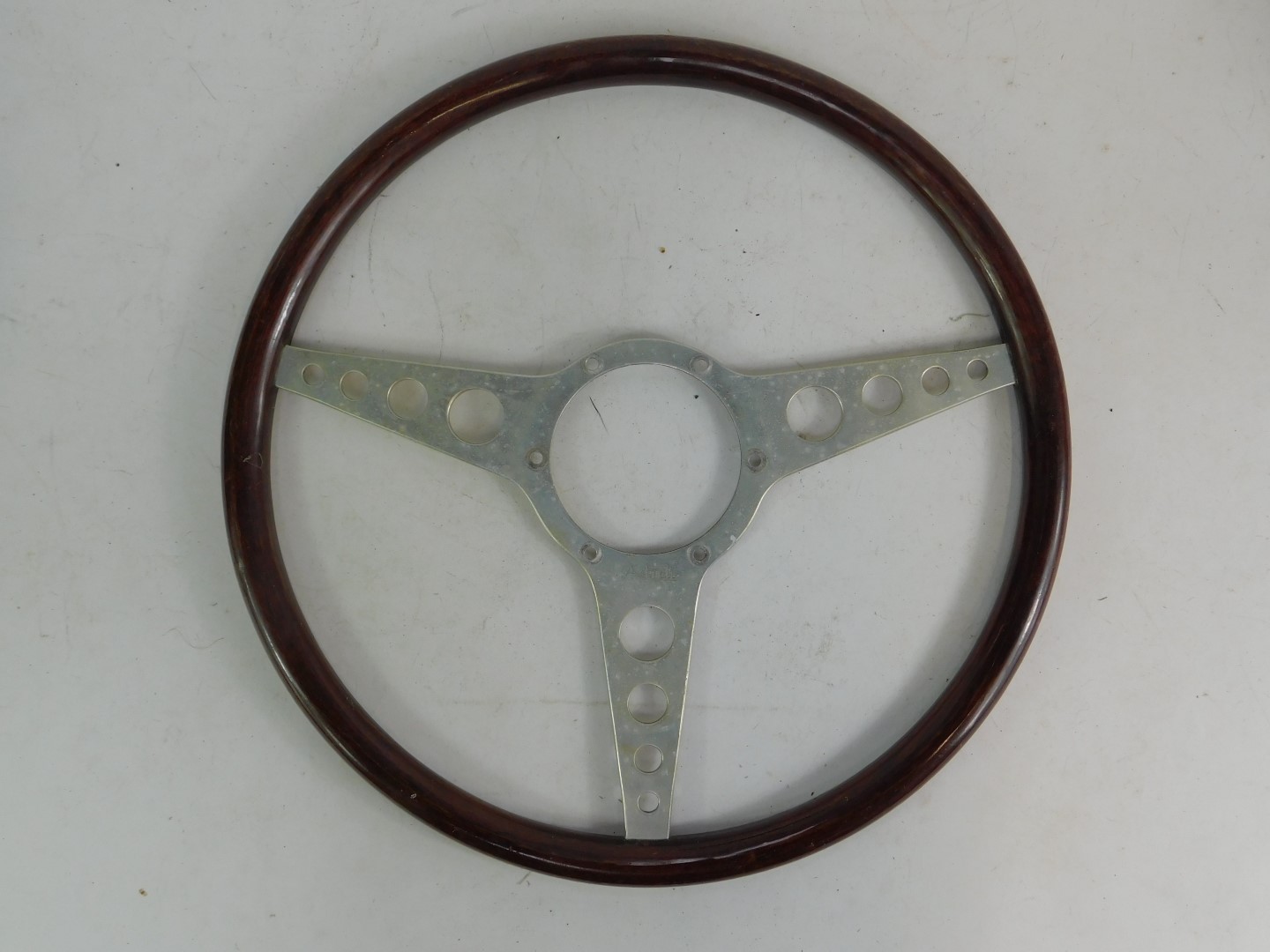 An Astrali 13" solid wood wheel, with polished alloy spokes and 9 hole ...