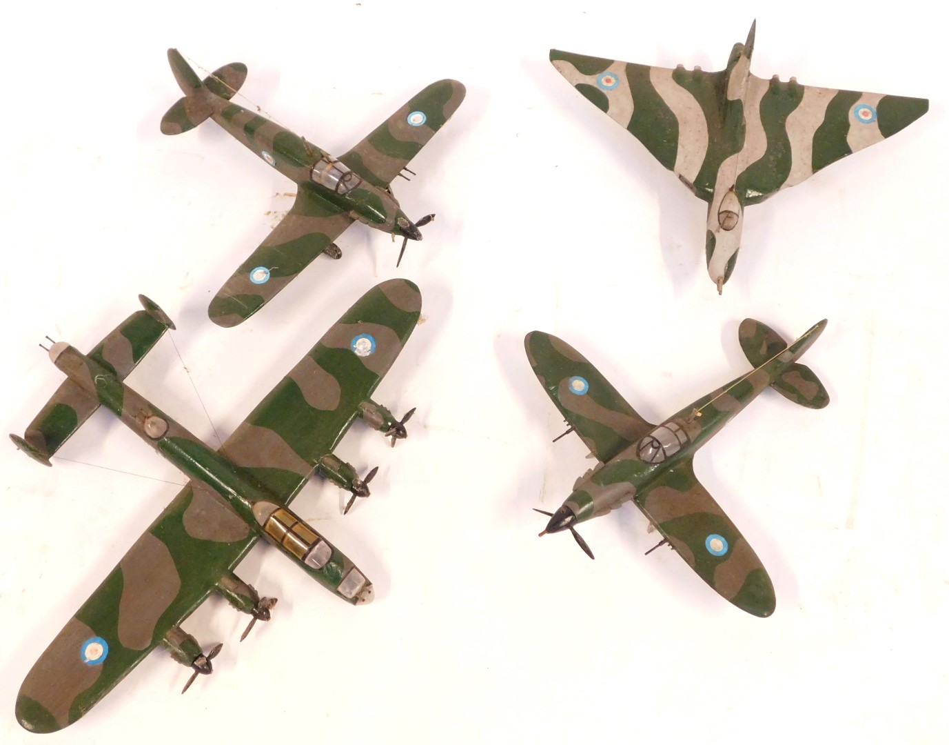 Four wooden scratch built models of World War II fighter planes, a ...