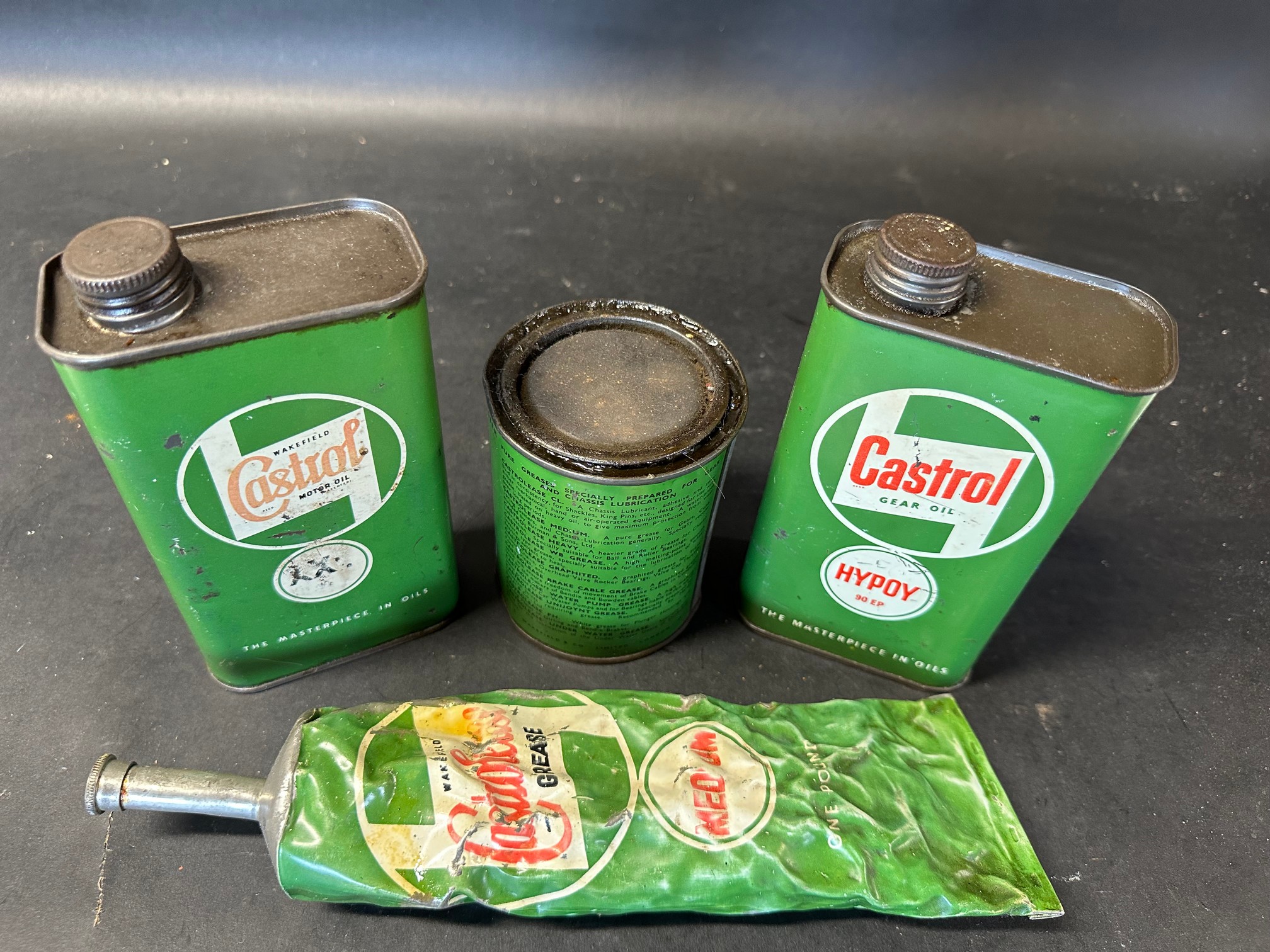 A Castrol grease tube, appears unusued, plus two Castrol pint cans and ...