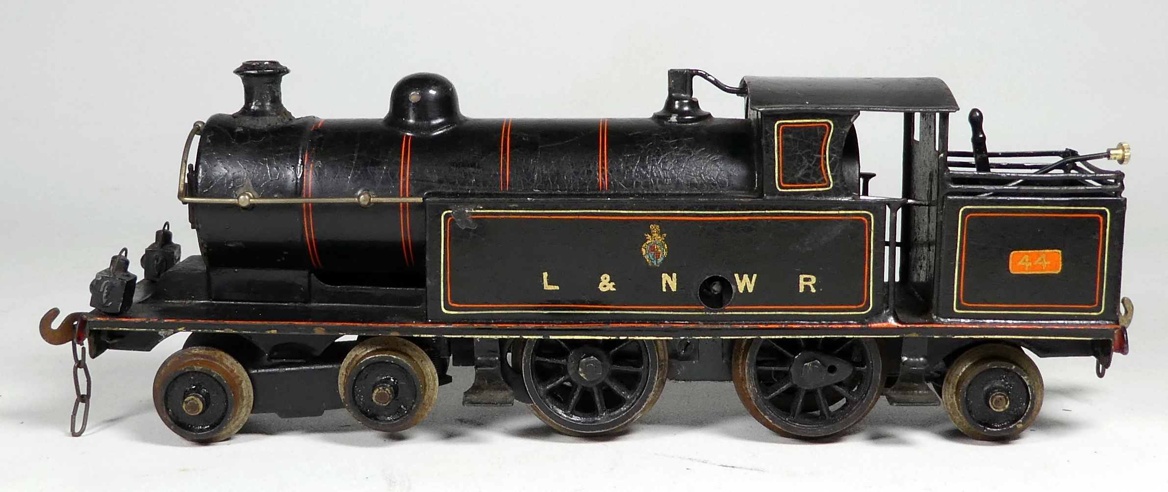 An 0 gauge clockwork locomotive L&NWR in black livery - together with ...