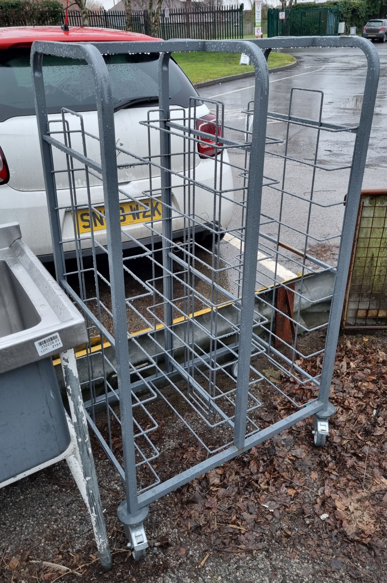 Brushed steel twin tray catering racking on wheels