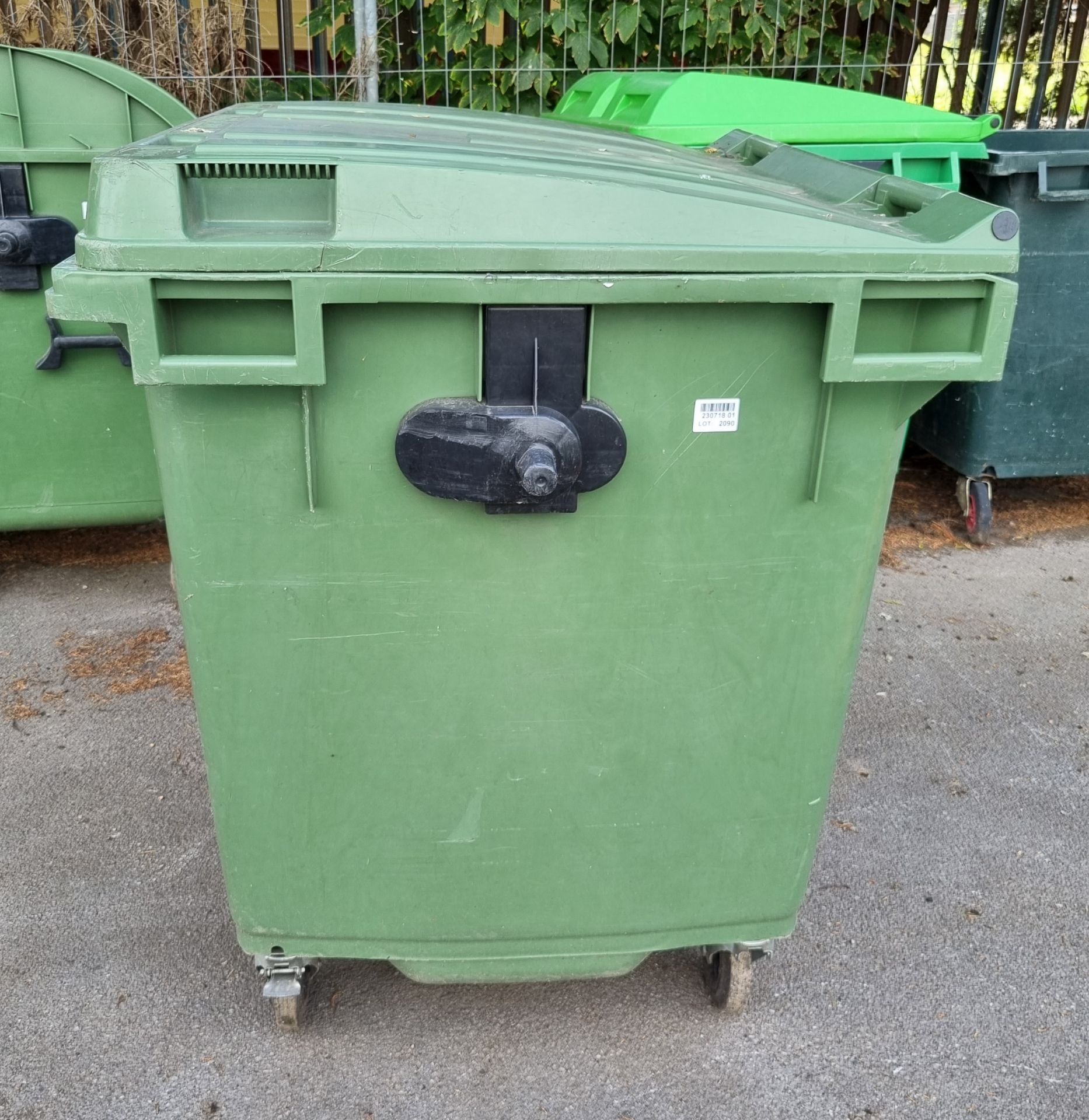 Large green plastic wheelie bin - L 1200 x W 1000 x H 1300mm