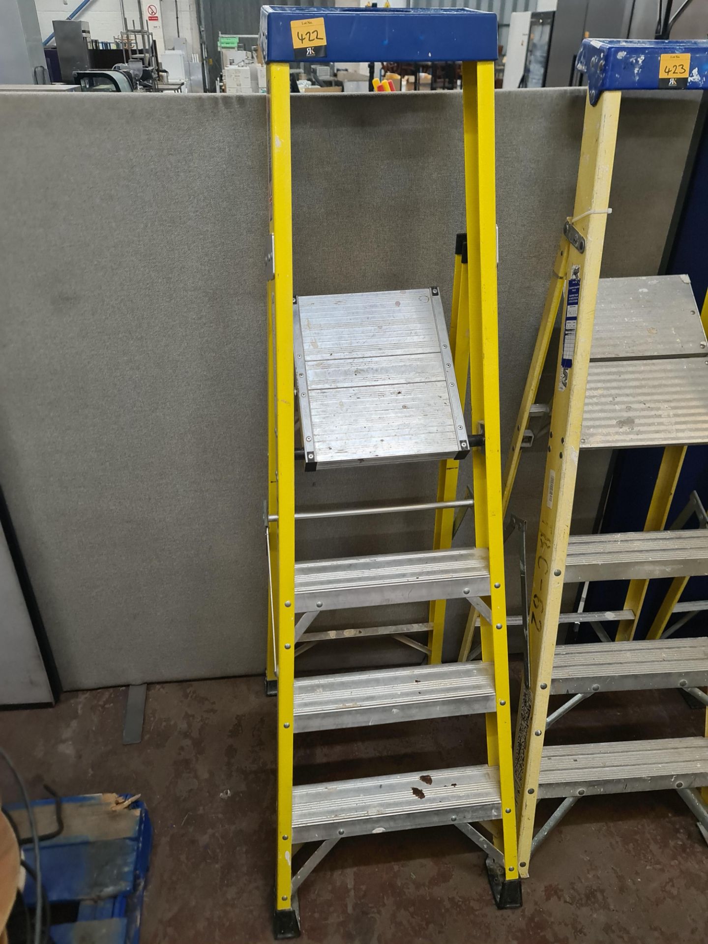 Set of 4 tread insulated folding stepladders. The ladders have 3 ...