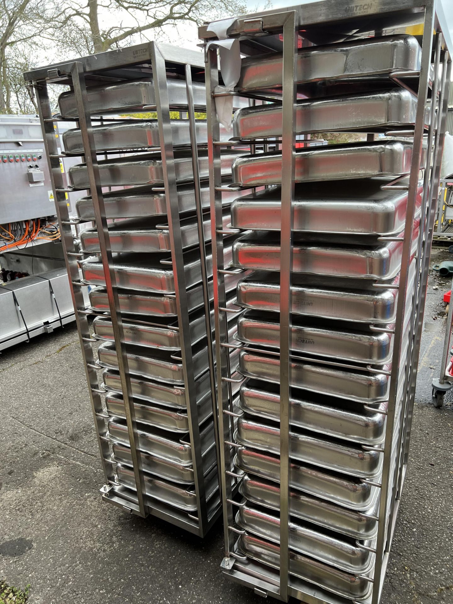 Two Mobile Unitech Trolleys, with 14 gastronome trays, each approx ...