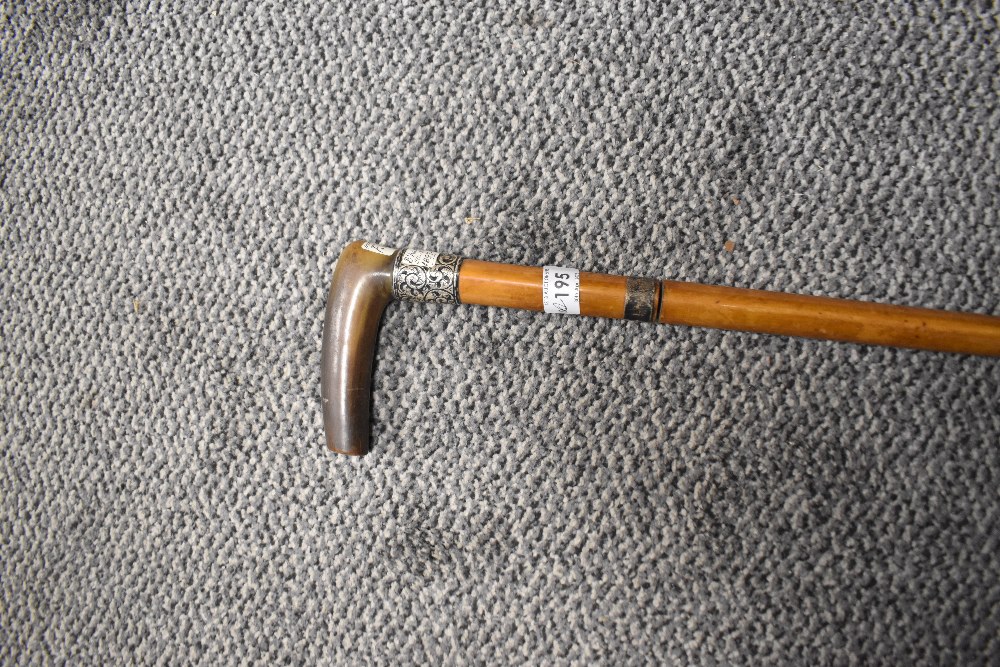 A Victorian walking cane, having hall marks for Birmingham, circa 1897/ ...