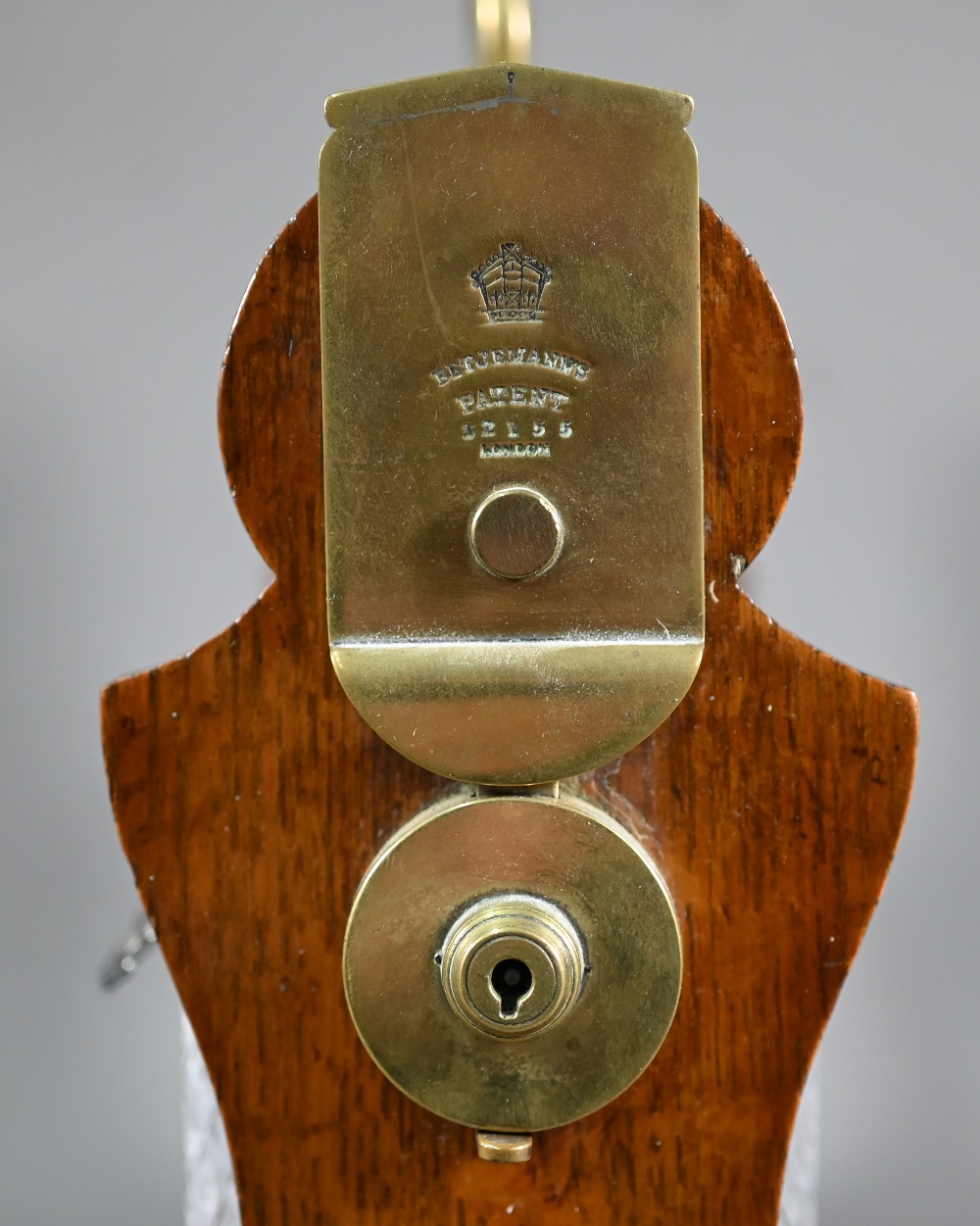 The Tantalus, an antique Betjemanns Patent brass mounted oak three ...