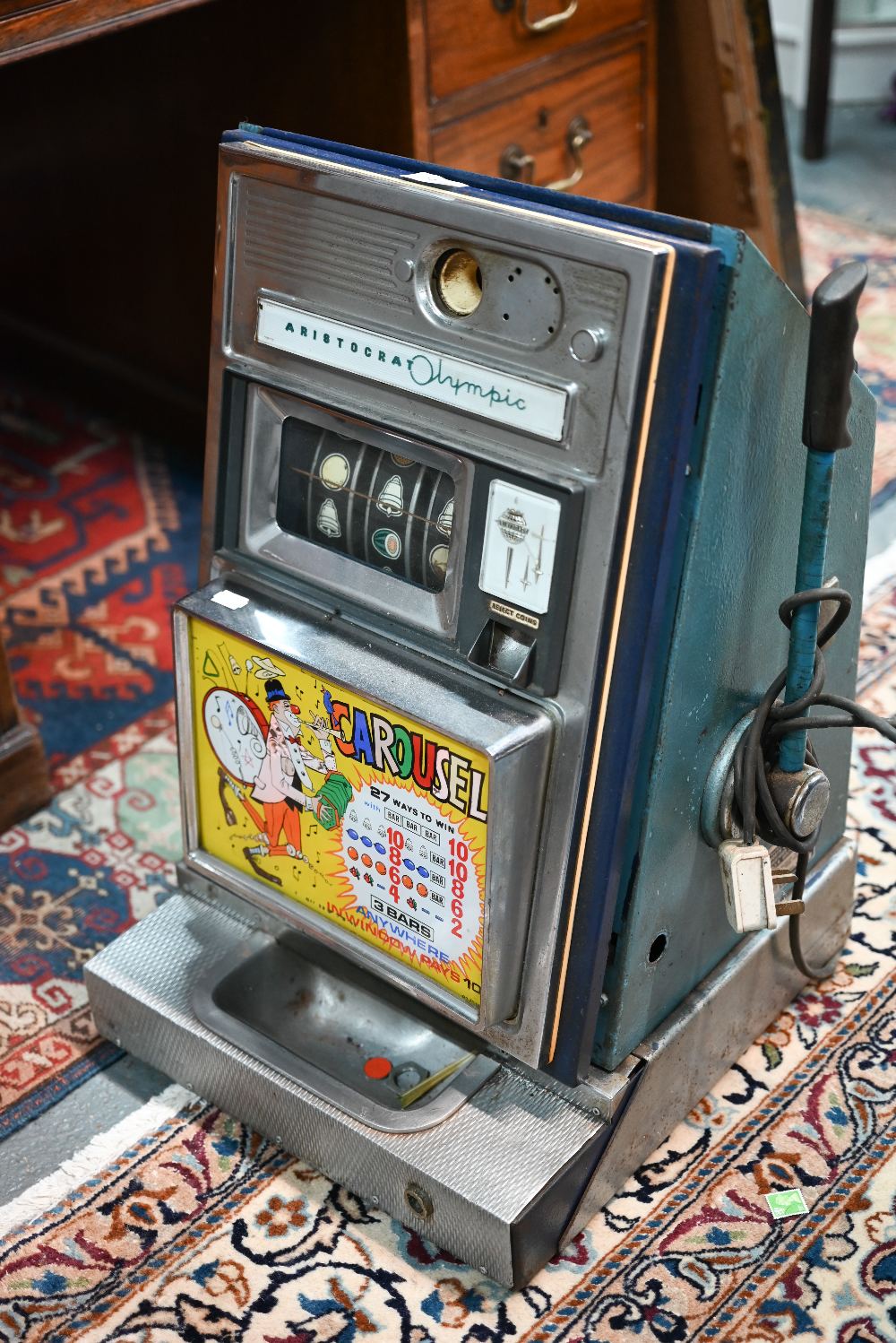 A vintage Aristocrat Olympic 'Carousel one-armed bandit' (fruit machine