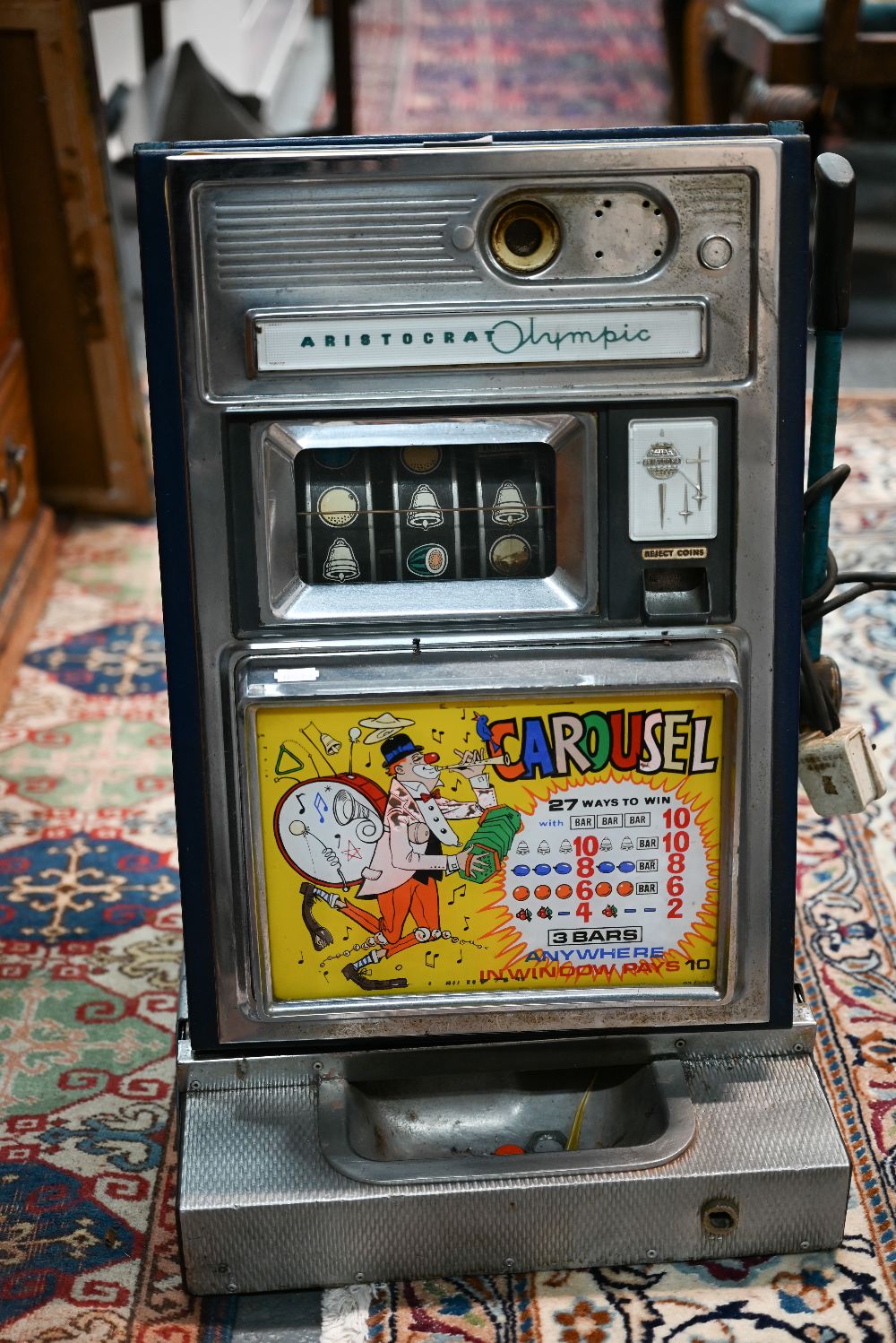 A vintage Aristocrat Olympic 'Carousel one-armed bandit' (fruit machine