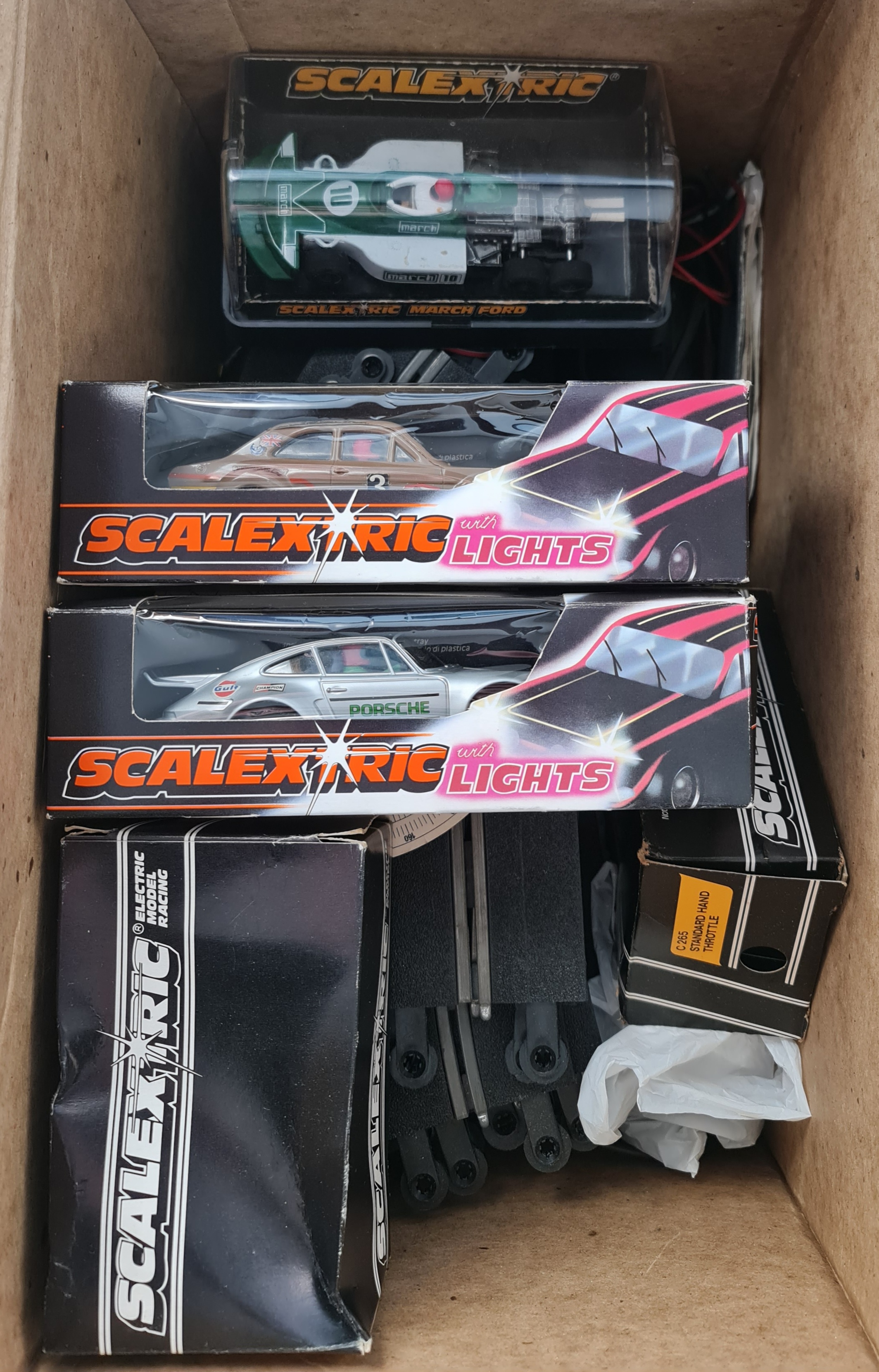 Two Scalextric boxed cars with lights one March Ford track etc.