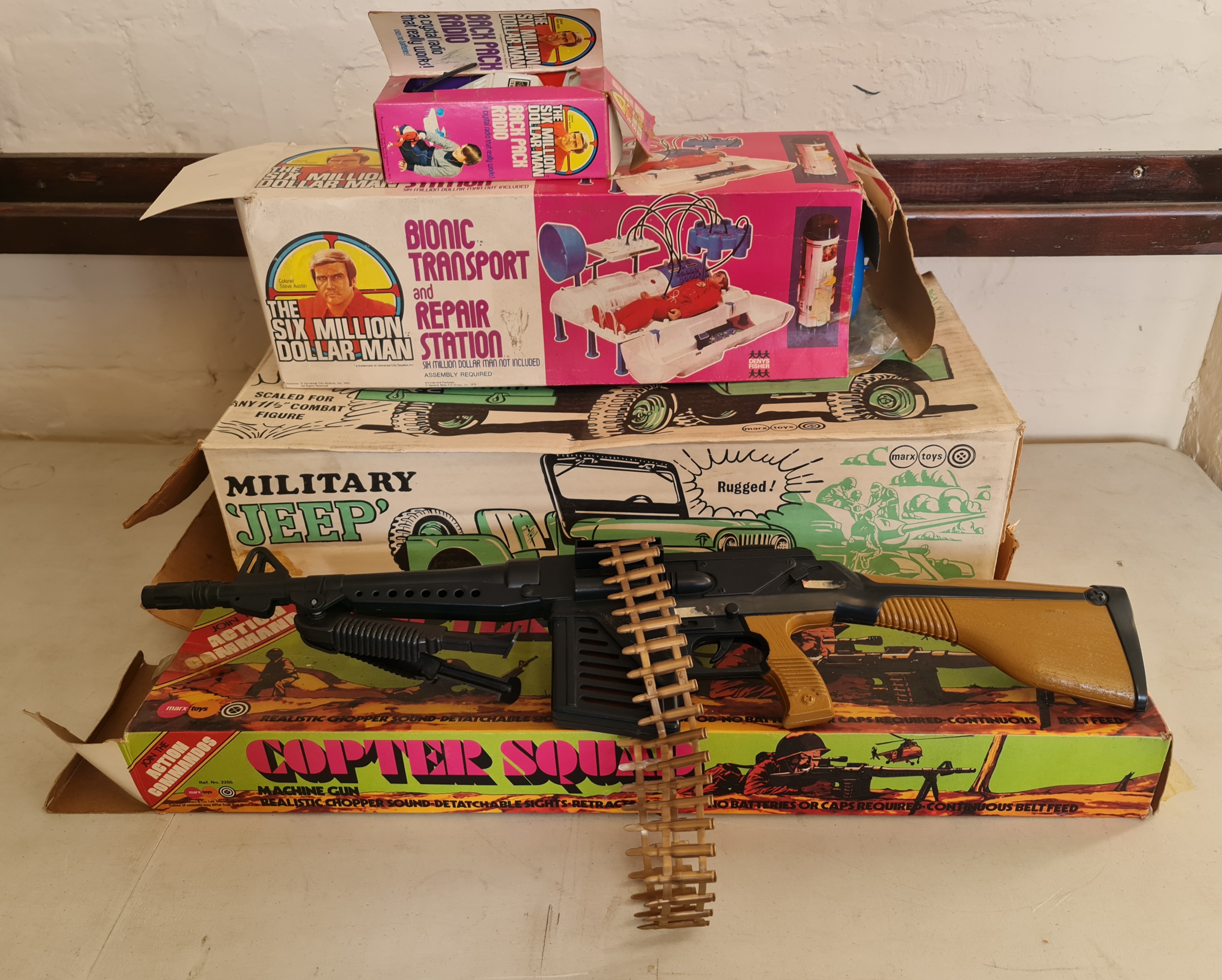 A Marx military jeep and copter squad rifle together with The six ...
