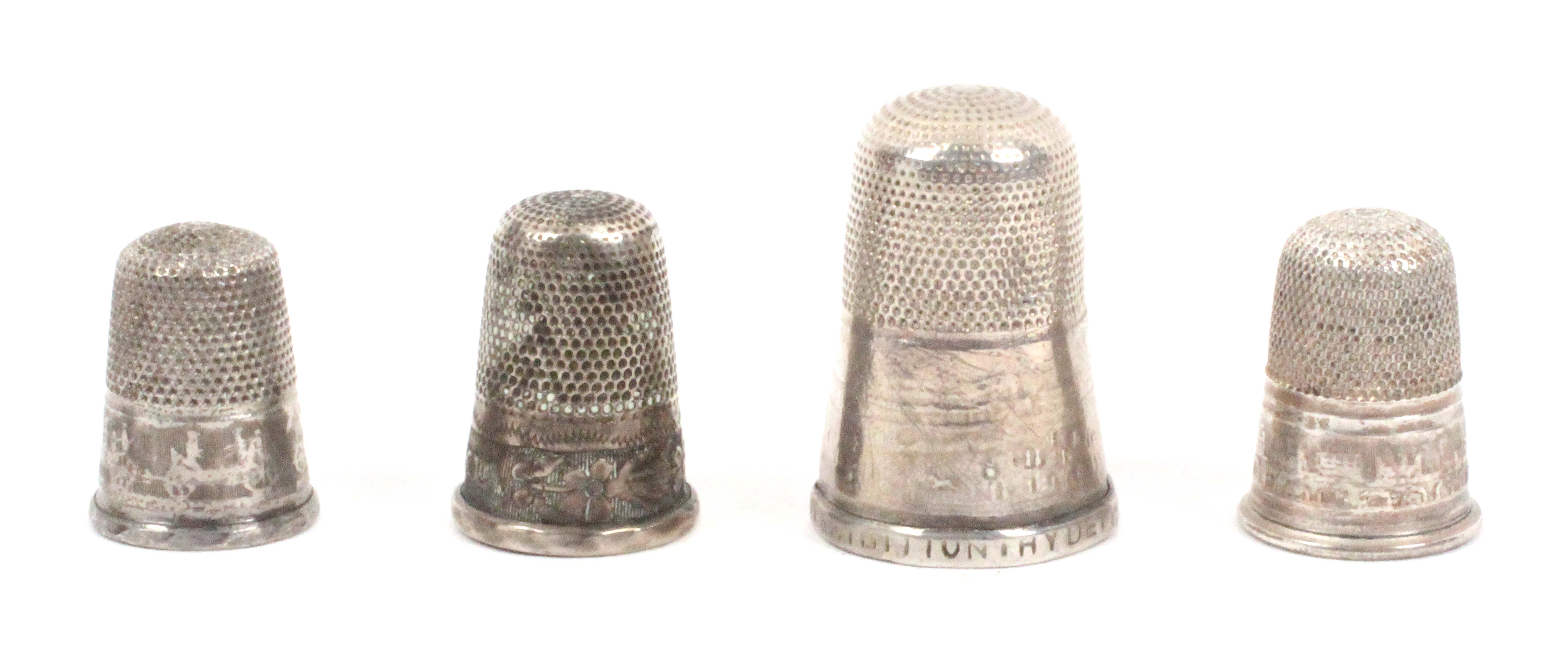 Four silver thimbles, comprising a small silver thimble, the reeded ...