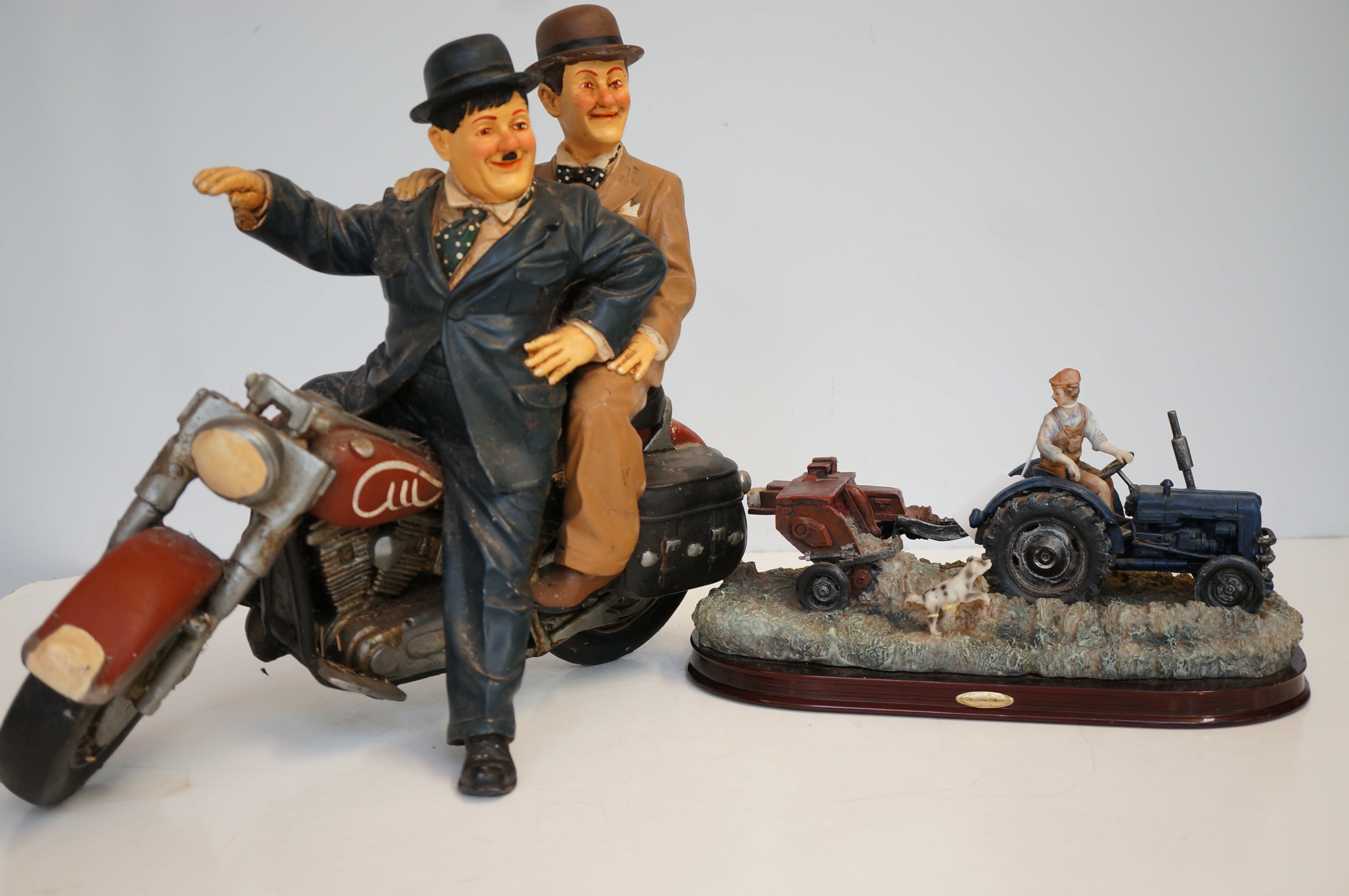 Large Laurel & Hardy figure on motorbike(Motorbike A.F) together with a ...