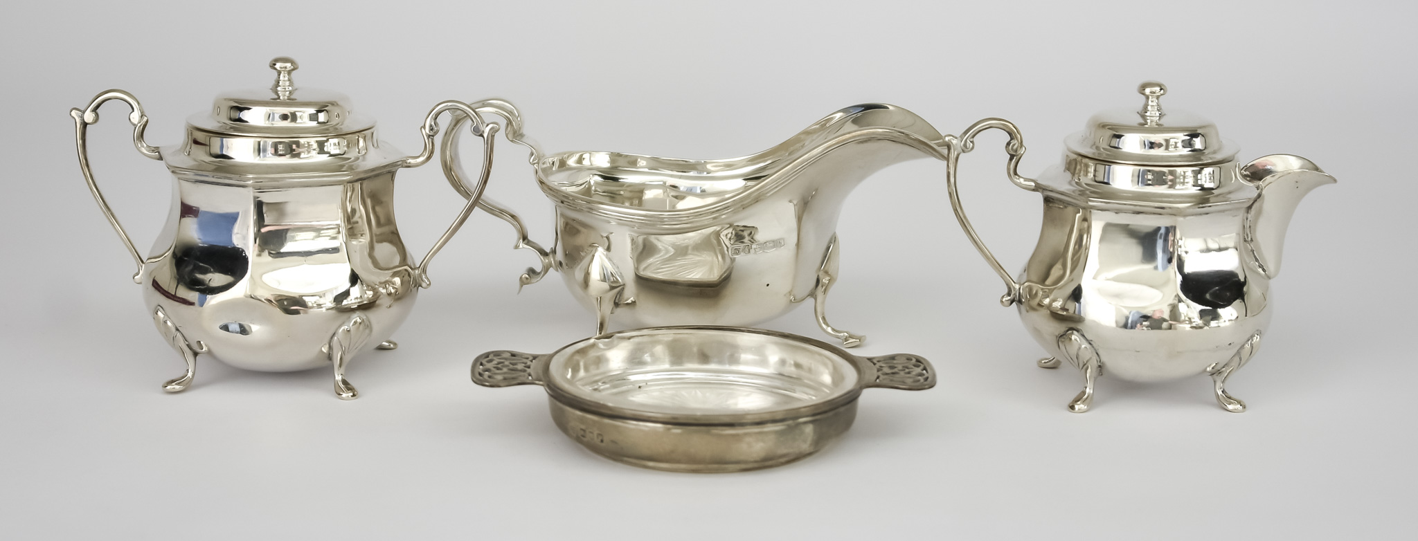 A George V Silver Oval Sauce-Boat and Mixed Silverware, the sauce-boat ...