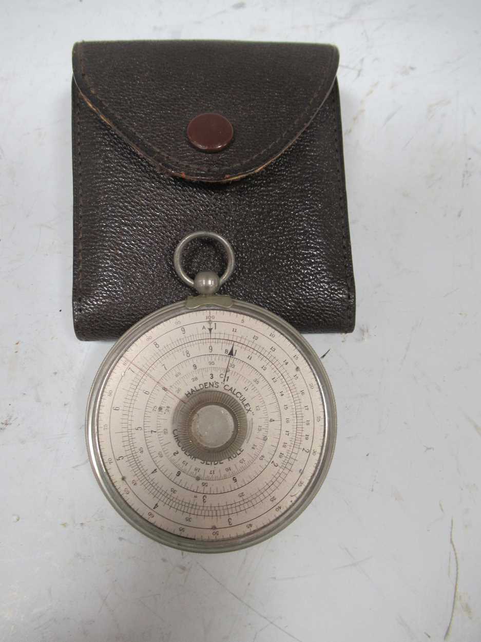 A leather cased Halden Calculex circular slide rule, complete with ...