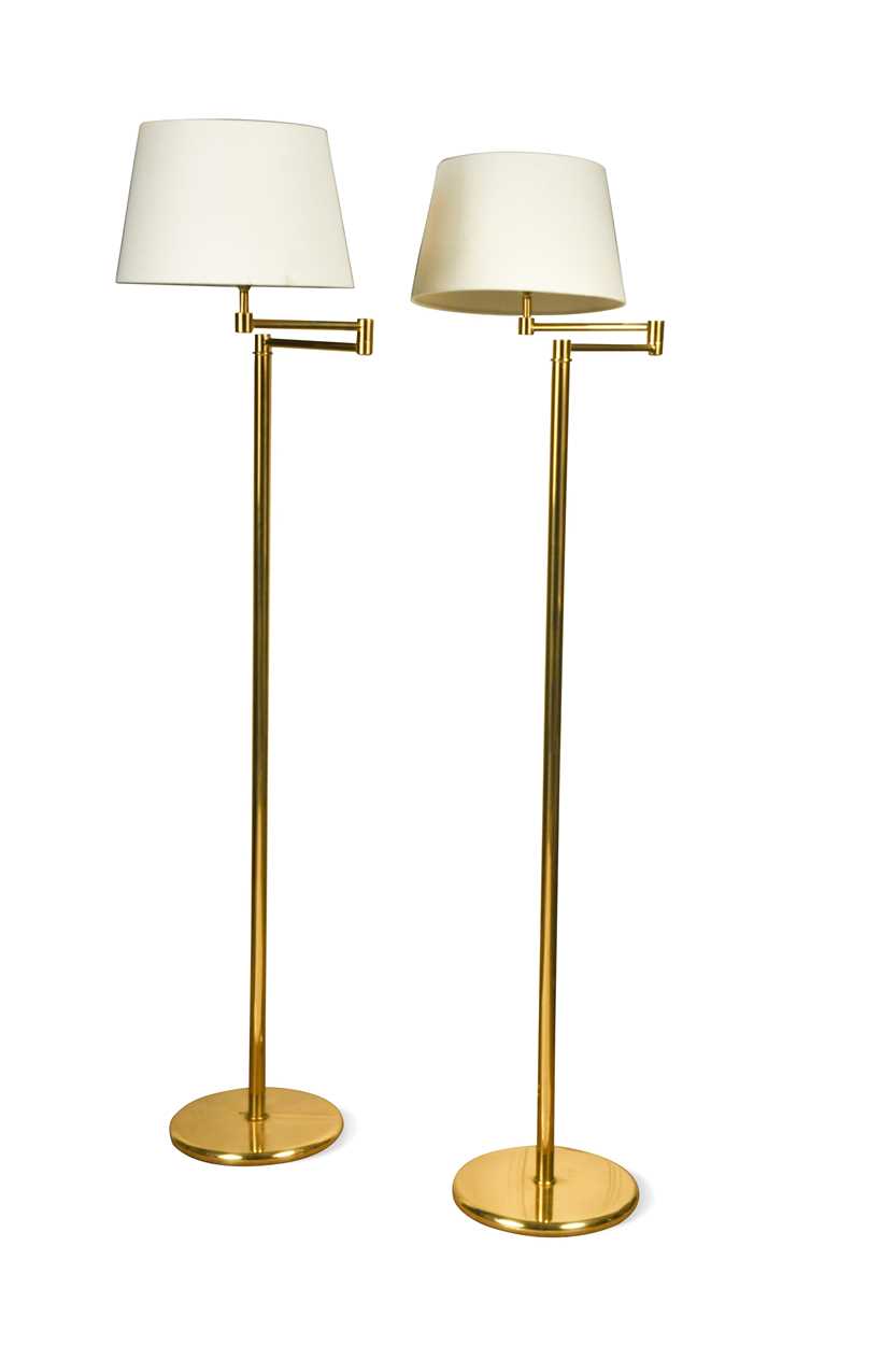 A pair of brass articulated reading lamps, each with an extendable ...