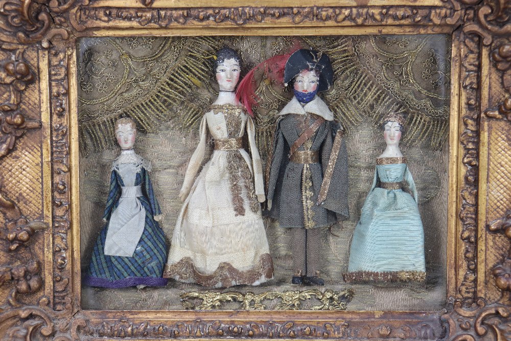 A charming family group of early wooden dolls, English early to mid ...
