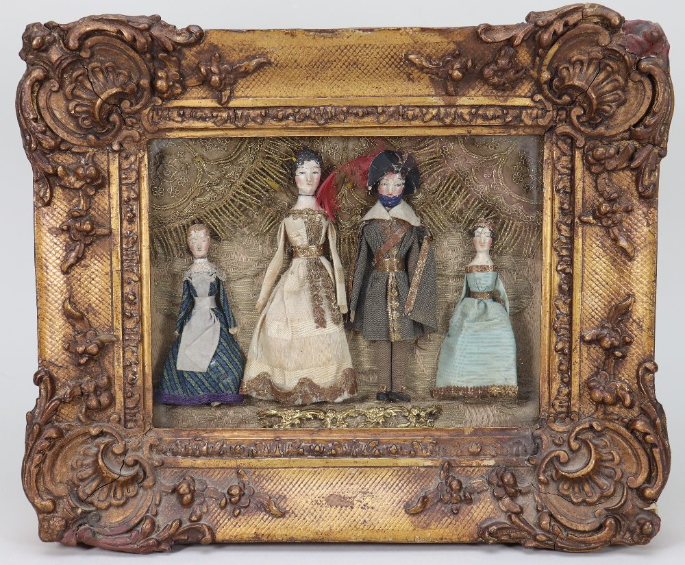 A charming family group of early wooden dolls, English early to mid ...