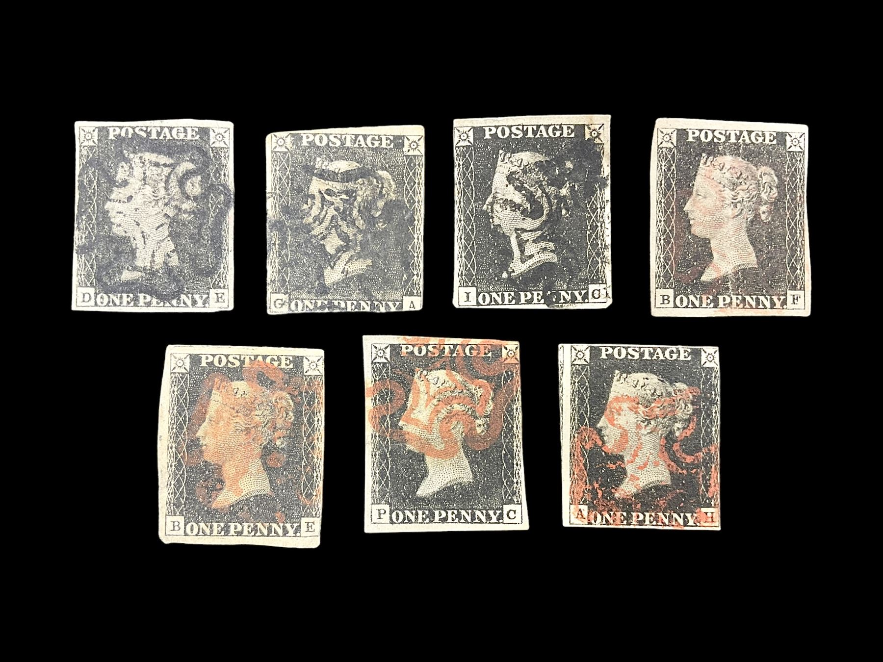 Seven Great Britain Queen Victoria penny black stamps, three with black ...