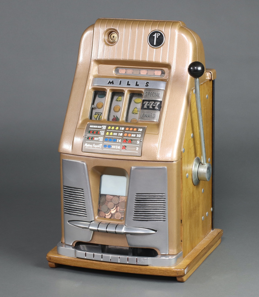 A restored and refurbished iron Mills One Armed Bandit 1p fruit machine ...
