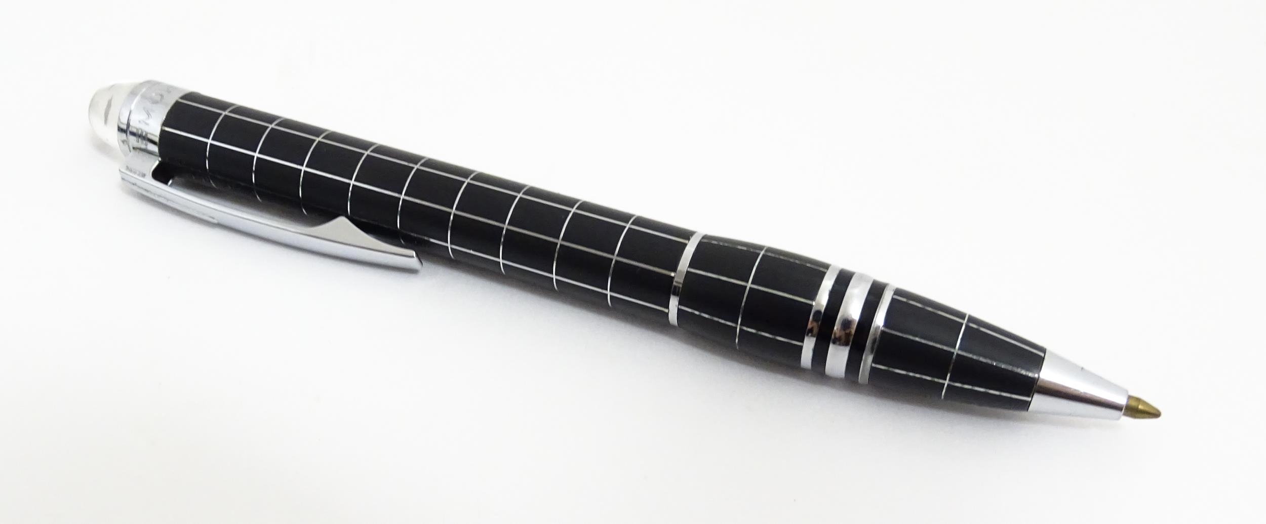 A cased Montblanc StarWalker ballpoint pen, in black finish with linear ...