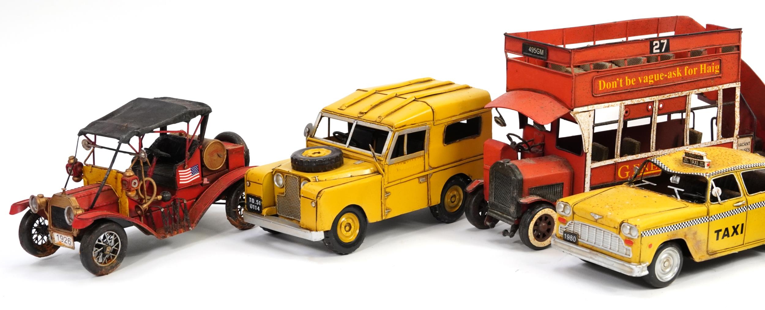Six vintage style tinplate vehicles including London buses and fire ...