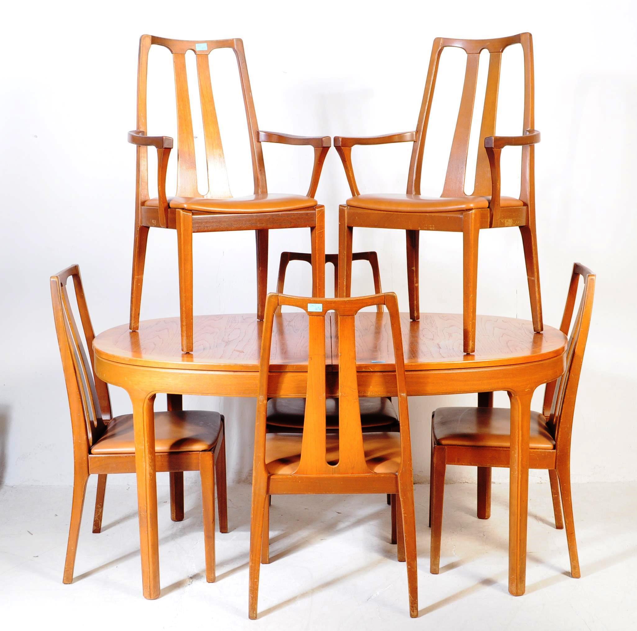 A vintage retro mid 20th century extendable teak dining table and ...
