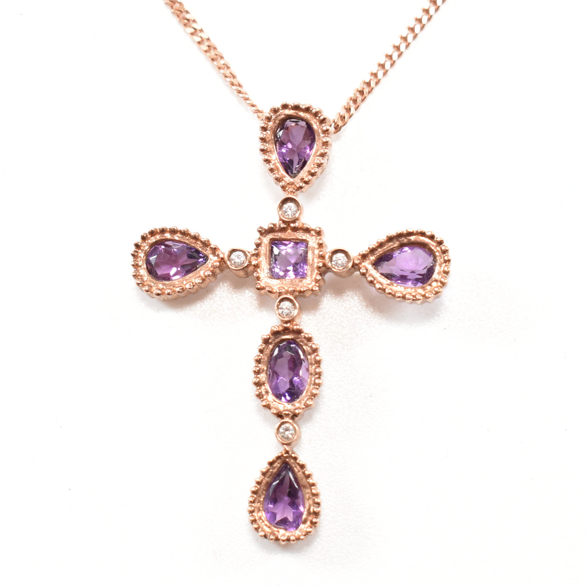 A hallmarked 9ct Clogau rose gold, amethyst and diamond pendant ...