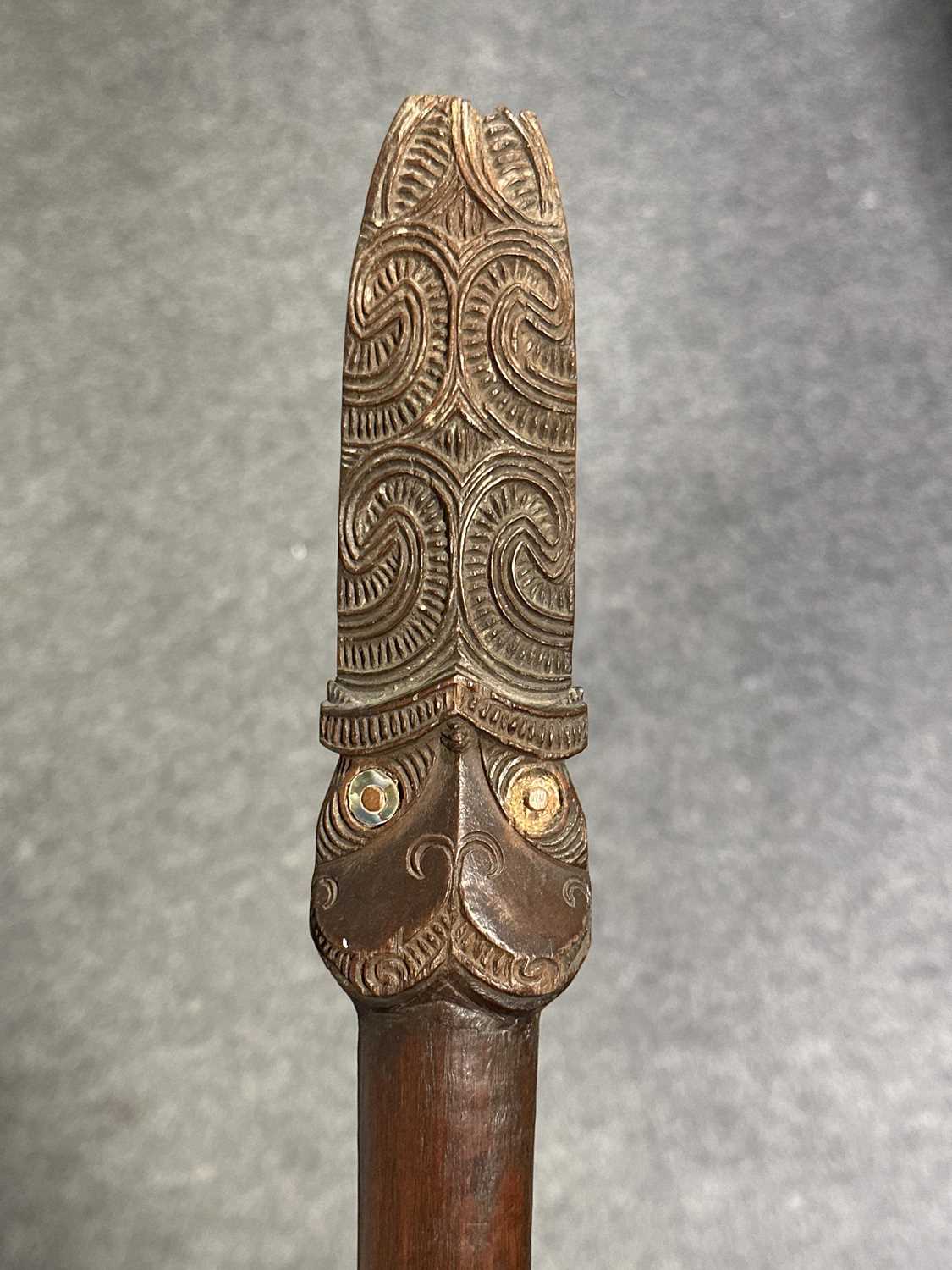 A New Zealand Maori hardwood Taiaha staff, the arched terminal with ...