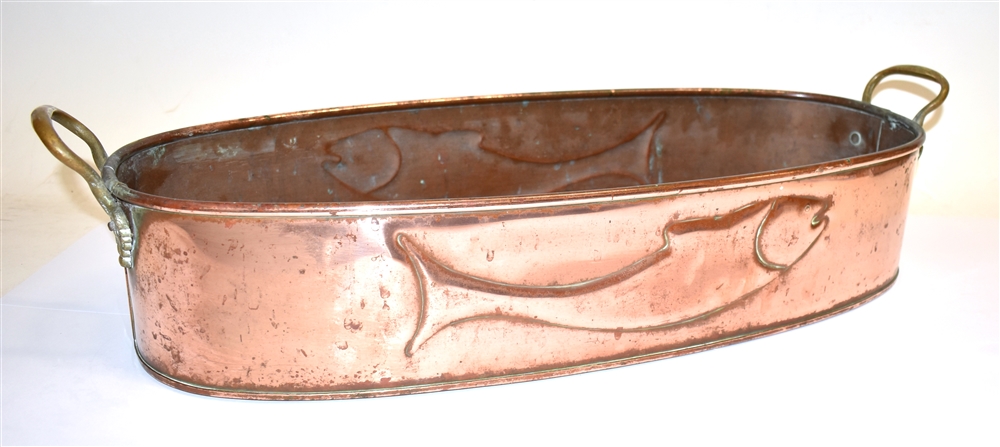 AN OVAL COPPER FISH KETTLE with brass handles, embossed with fish to ...