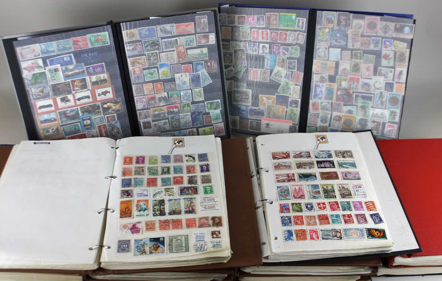 Thirteen albums of World stamps (most part-full), to include five ...