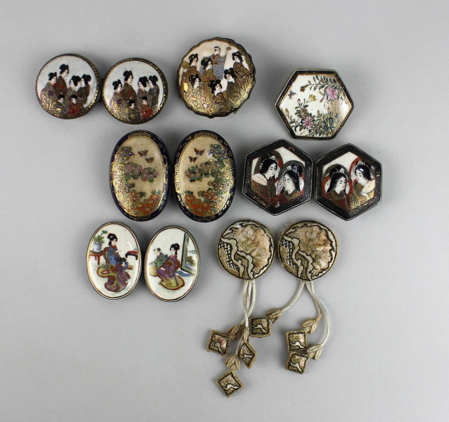 A collection of Japanese Satsuma ware porcelain two-piece belt buckles ...