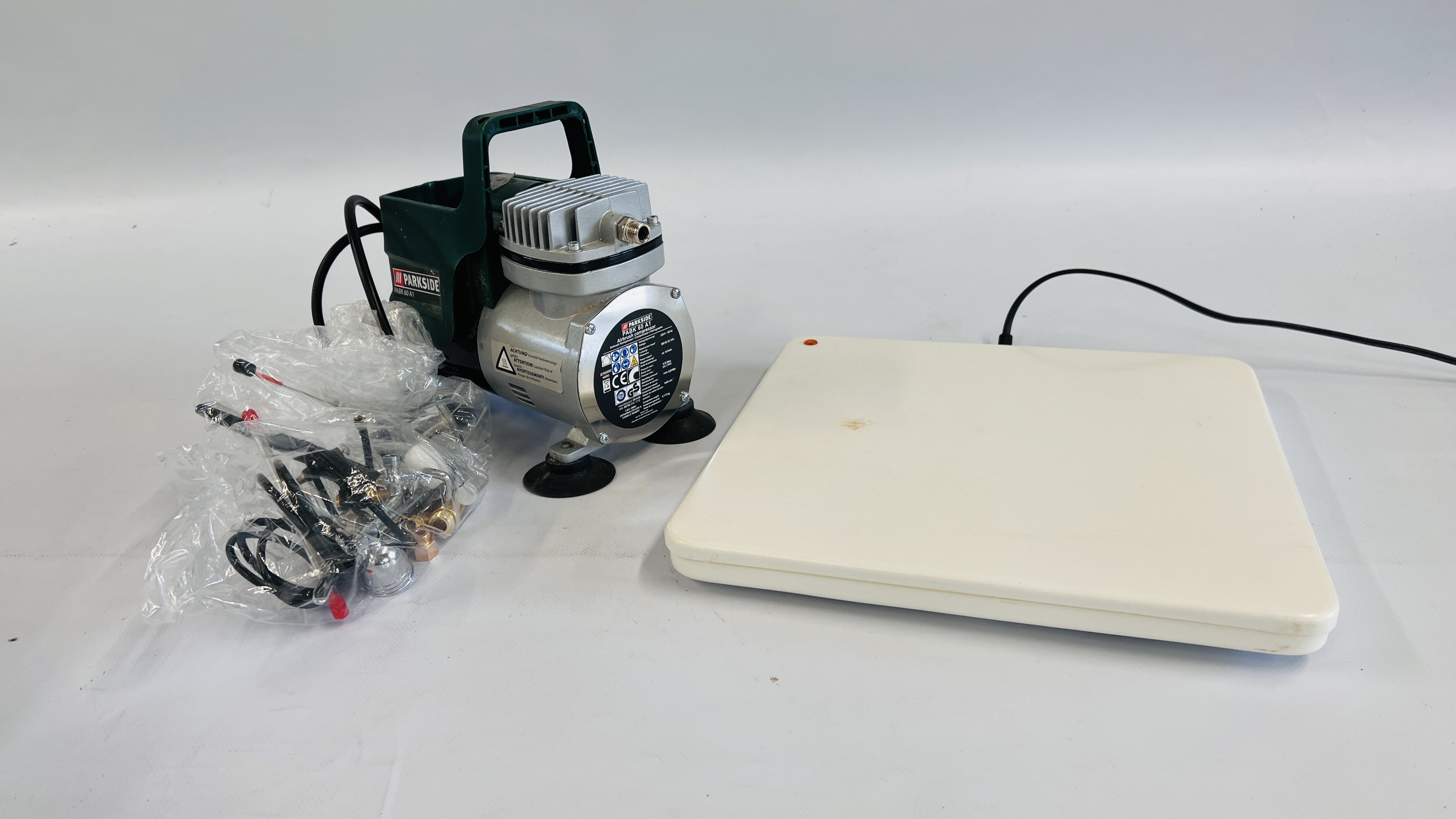 A PARKSIDE PABK 60 A1 AIRBRUSH COMPRESSOR ALONG WITH A HEAT PACK - SOLD ...